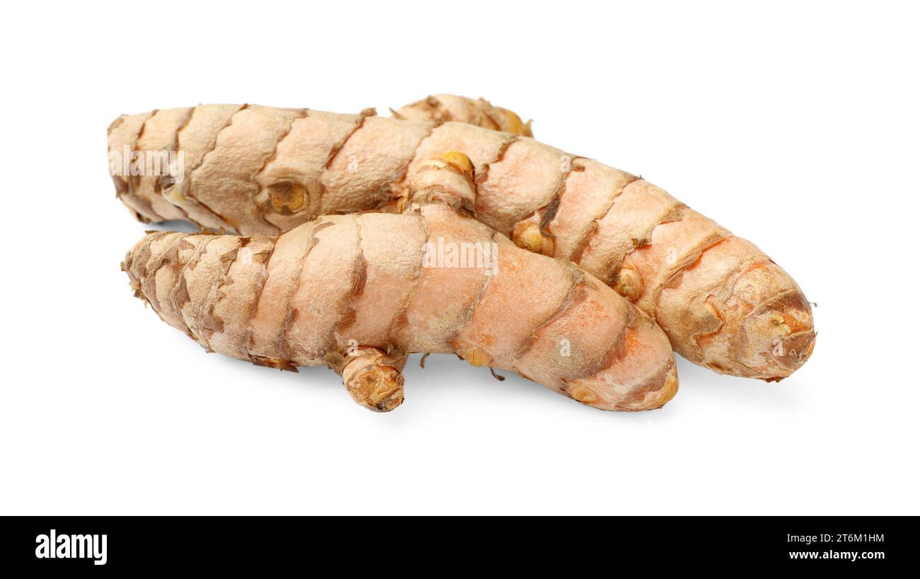 Fresh whole turmeric roots isolated on white Stock Photo - Alamy