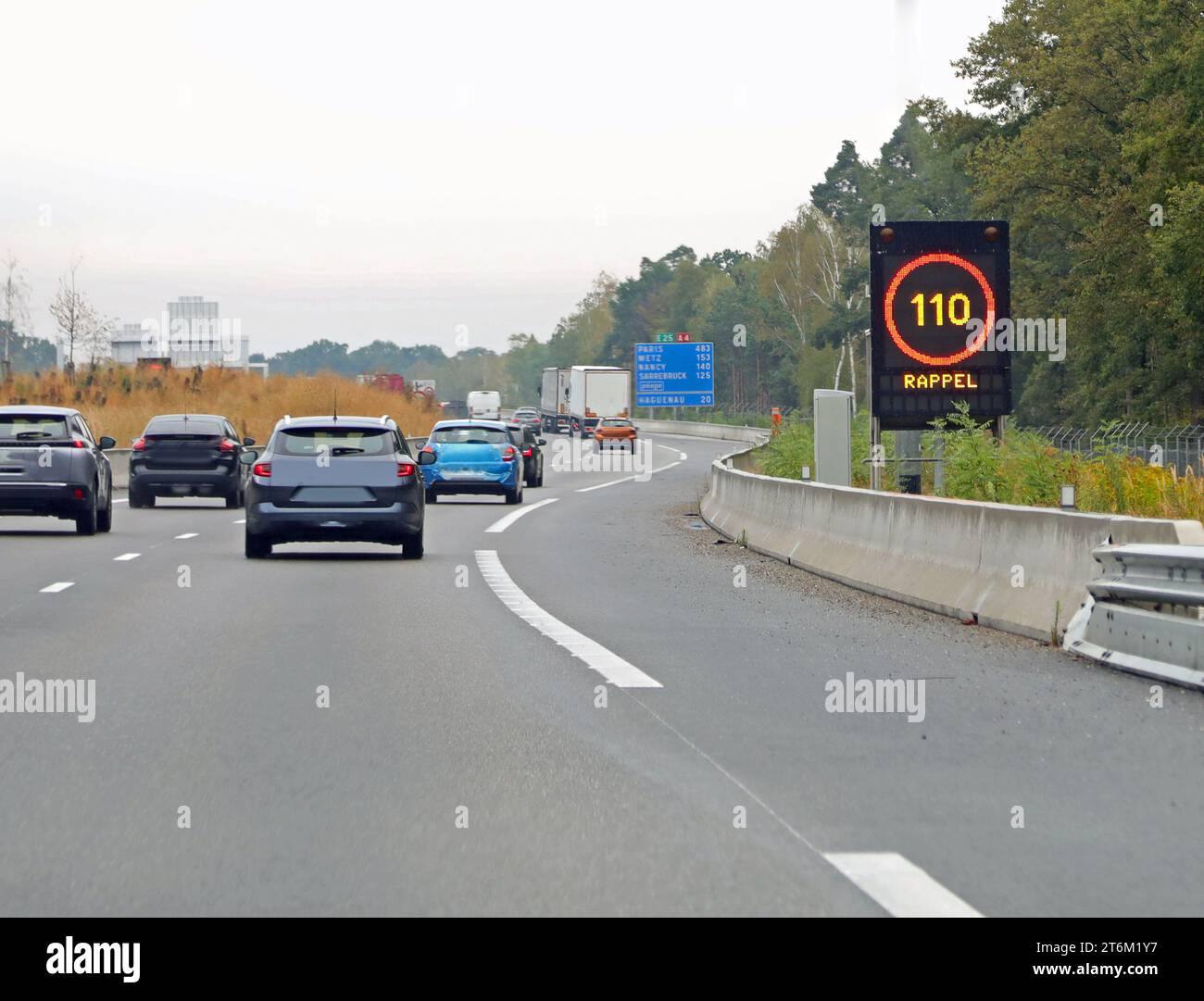 highway sign with speed limit of 110 km per hour and the text RAPPEL ...