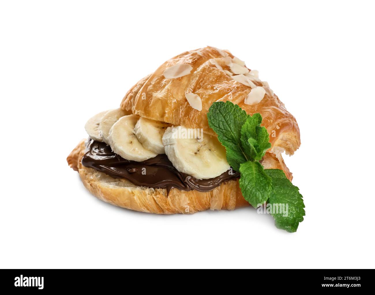 Delicious croissant with banana, chocolate and mint isolated on white ...