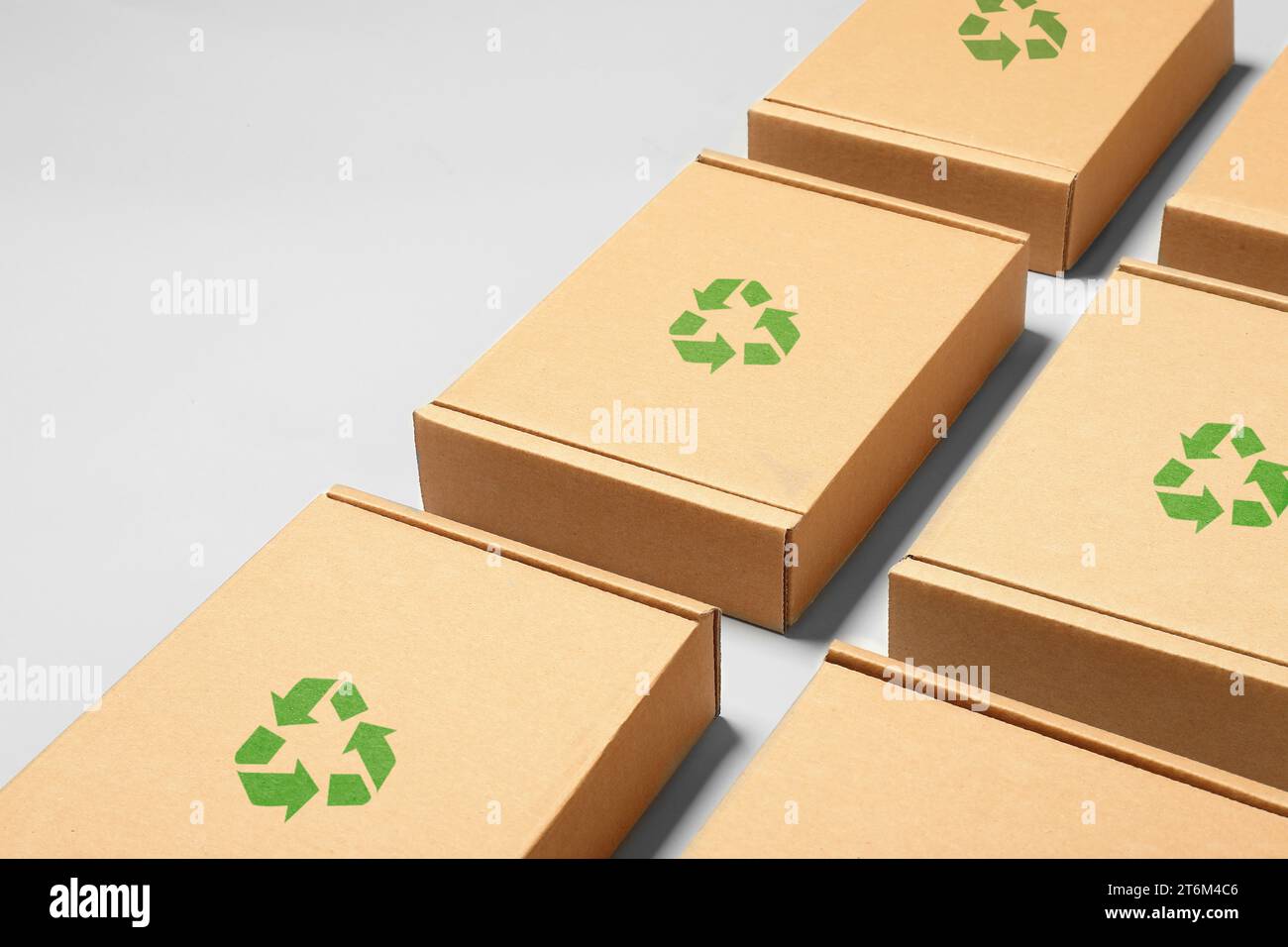 Cardboard boxes with recycle sign stamps on light grey background ...