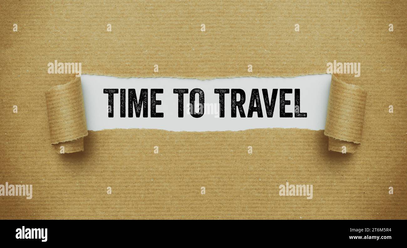 Torn paper revealing the words Time to travel Stock Photo - Alamy