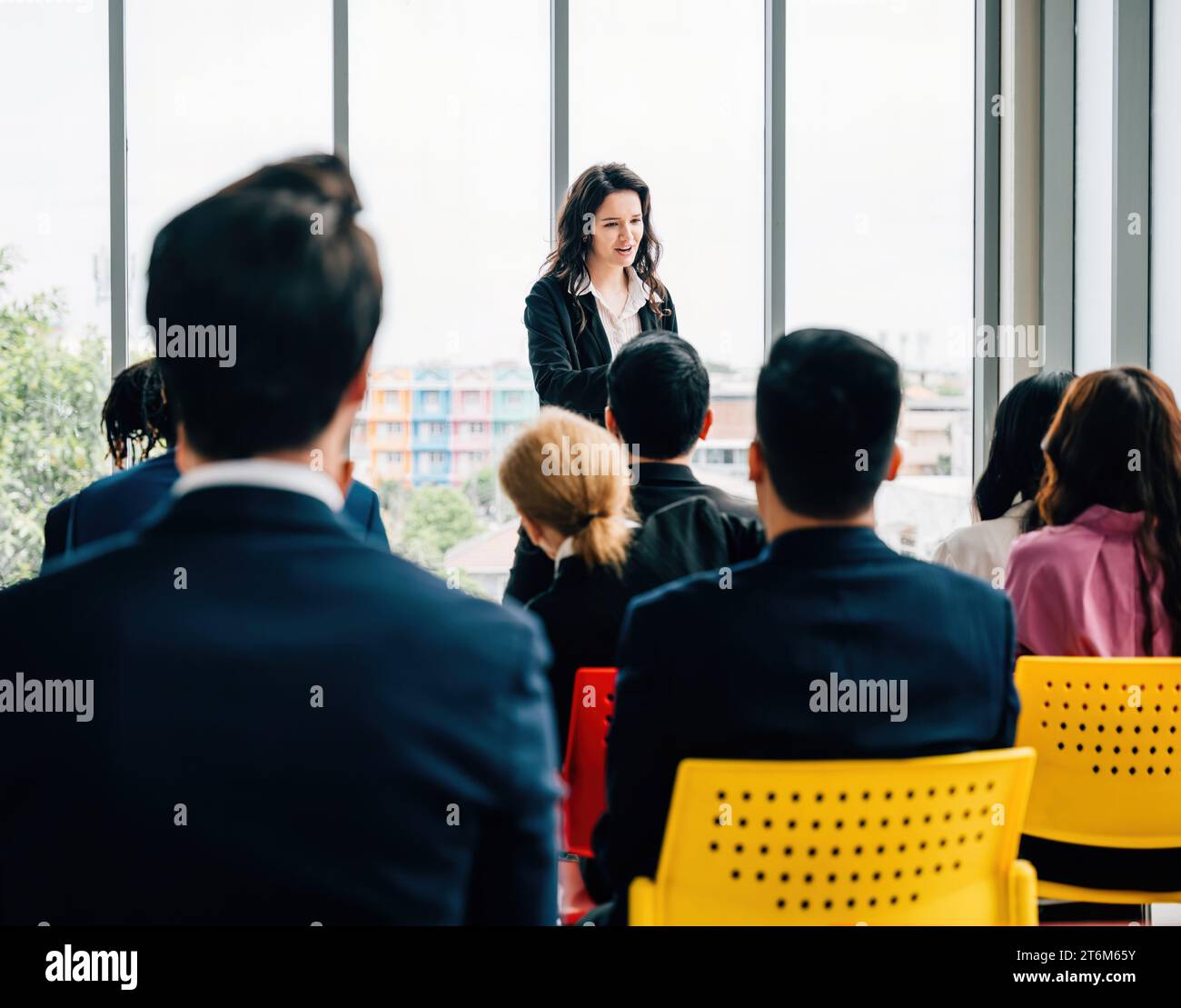 Business professionals of various backgrounds come together in an ...