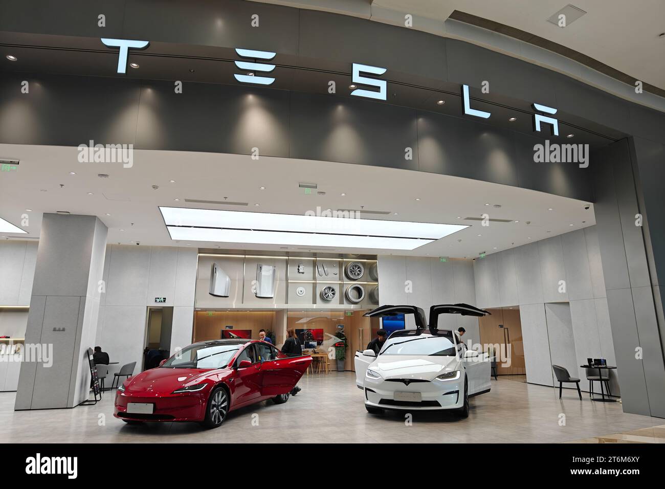 SHANGHAI, CHINA - NOVEMBER 11, 2023 - Customers shop at a Tesla new ...
