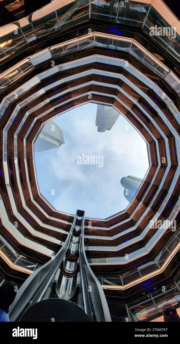 An architectural structure with a large circular roof is visible, with ...