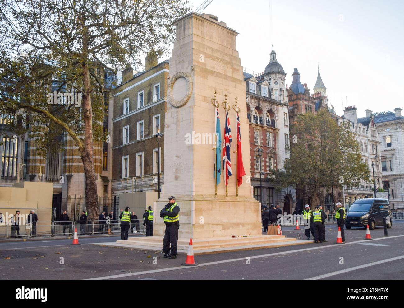 London, UK. 11th November 2023. Police officers guard The Cenotaph war ...