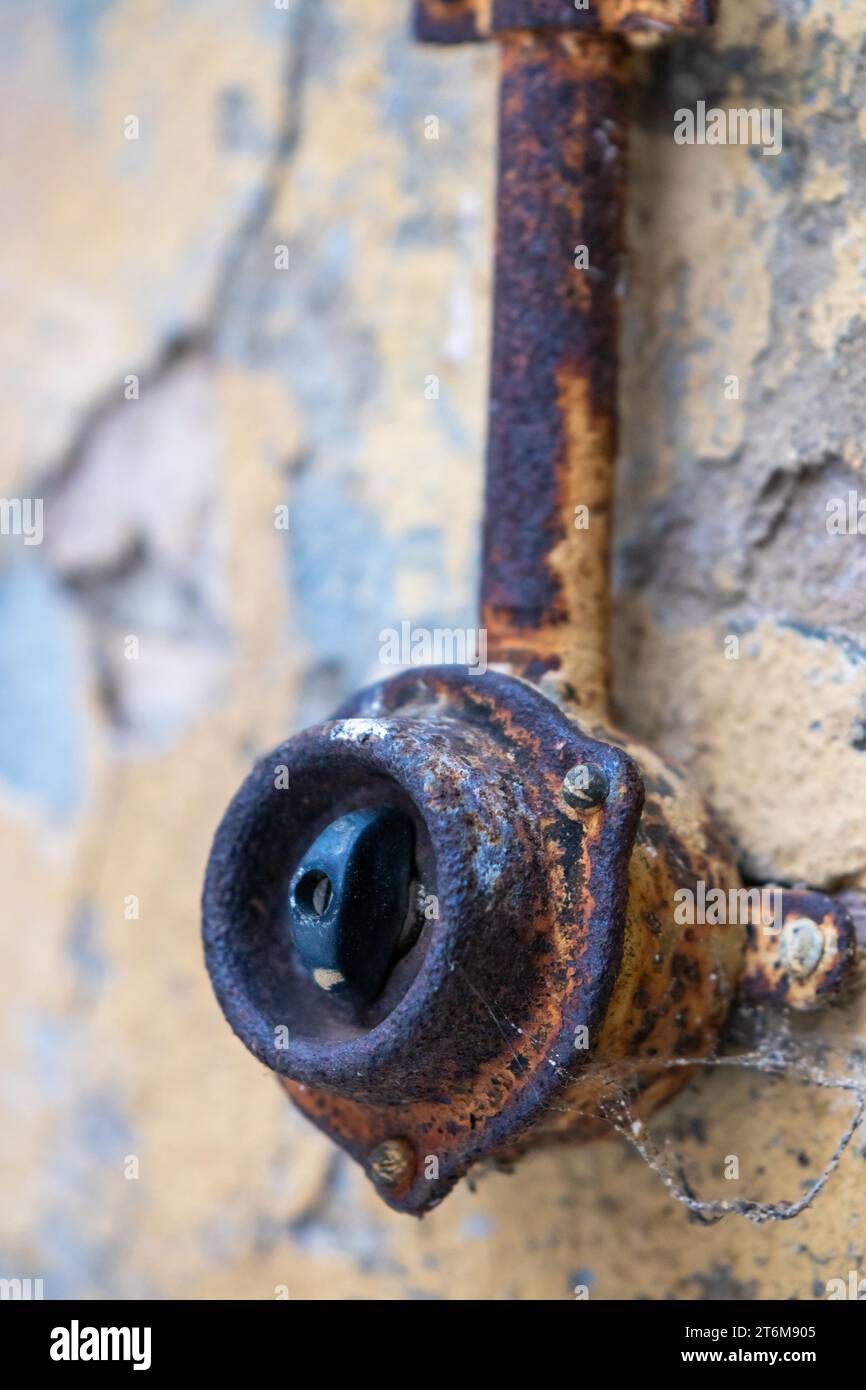 ancient old light switch rusted on crumbling concrete wall with cobwebs ...