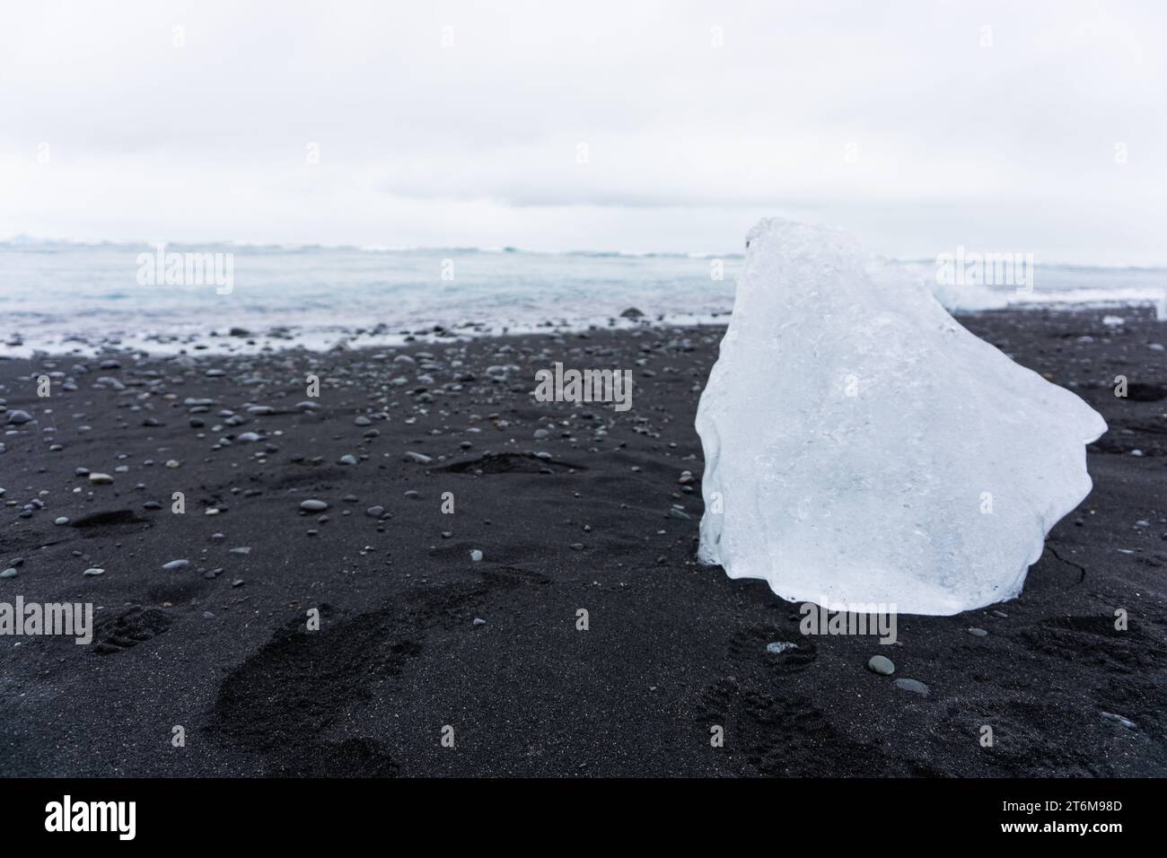 A block of ice on a volcanic beach in Iceland Stock Photo - Alamy