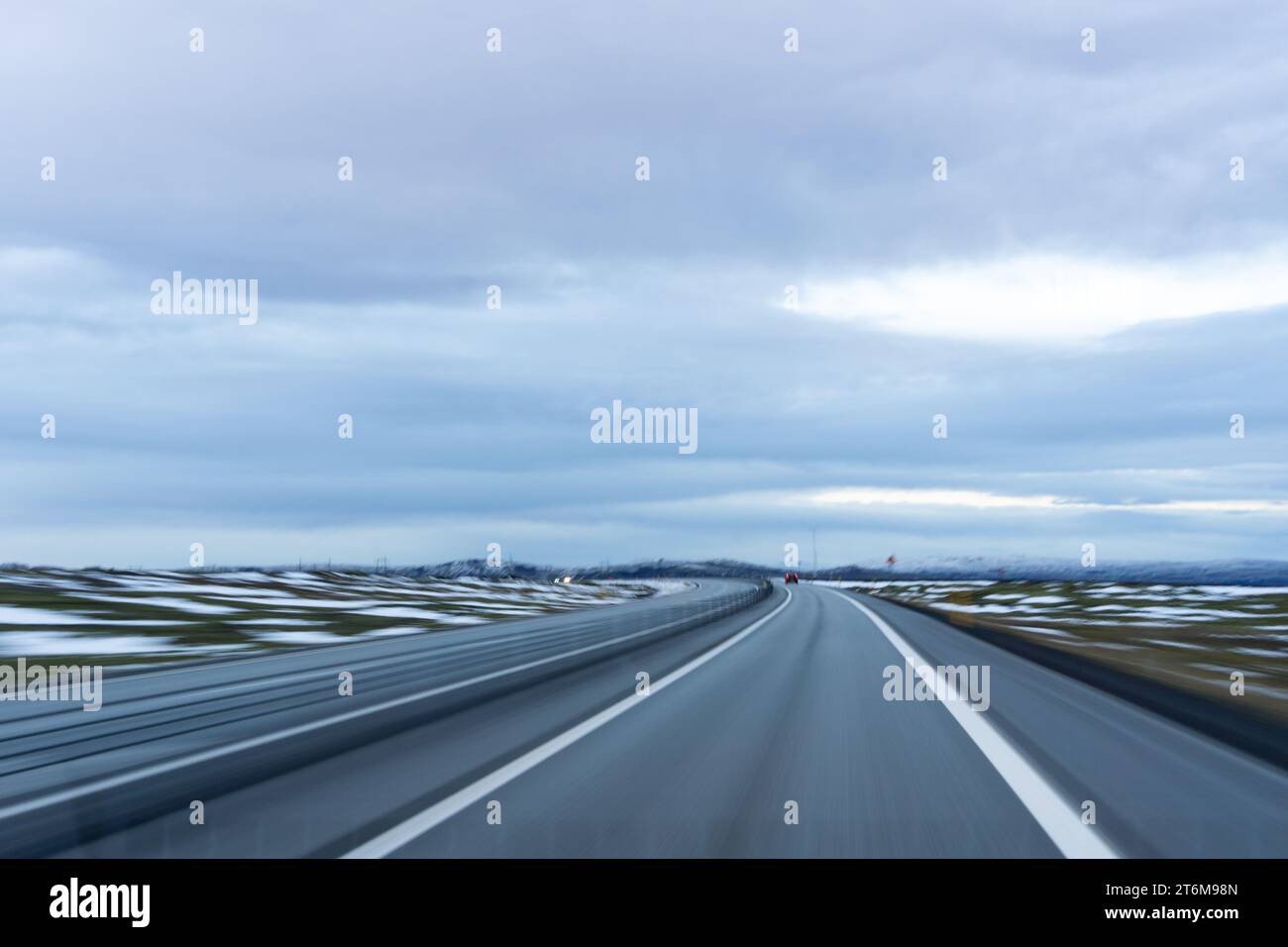 An icelandic road surrounded by nature and ice. Photo taken while ...
