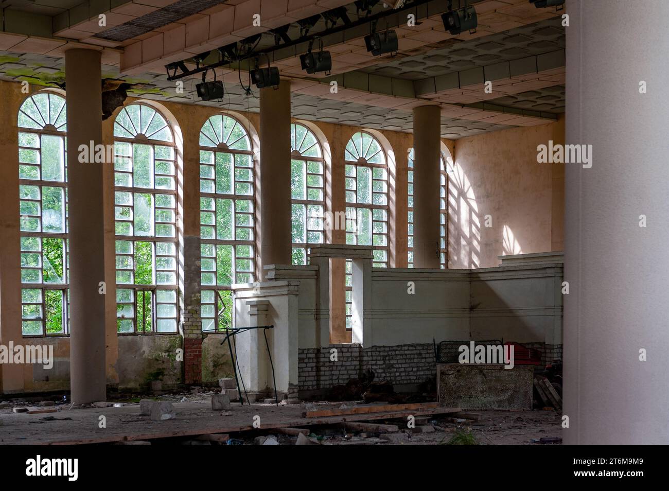 Glass wall inside of an abandoned garden pavilion. Empty abandoned ...