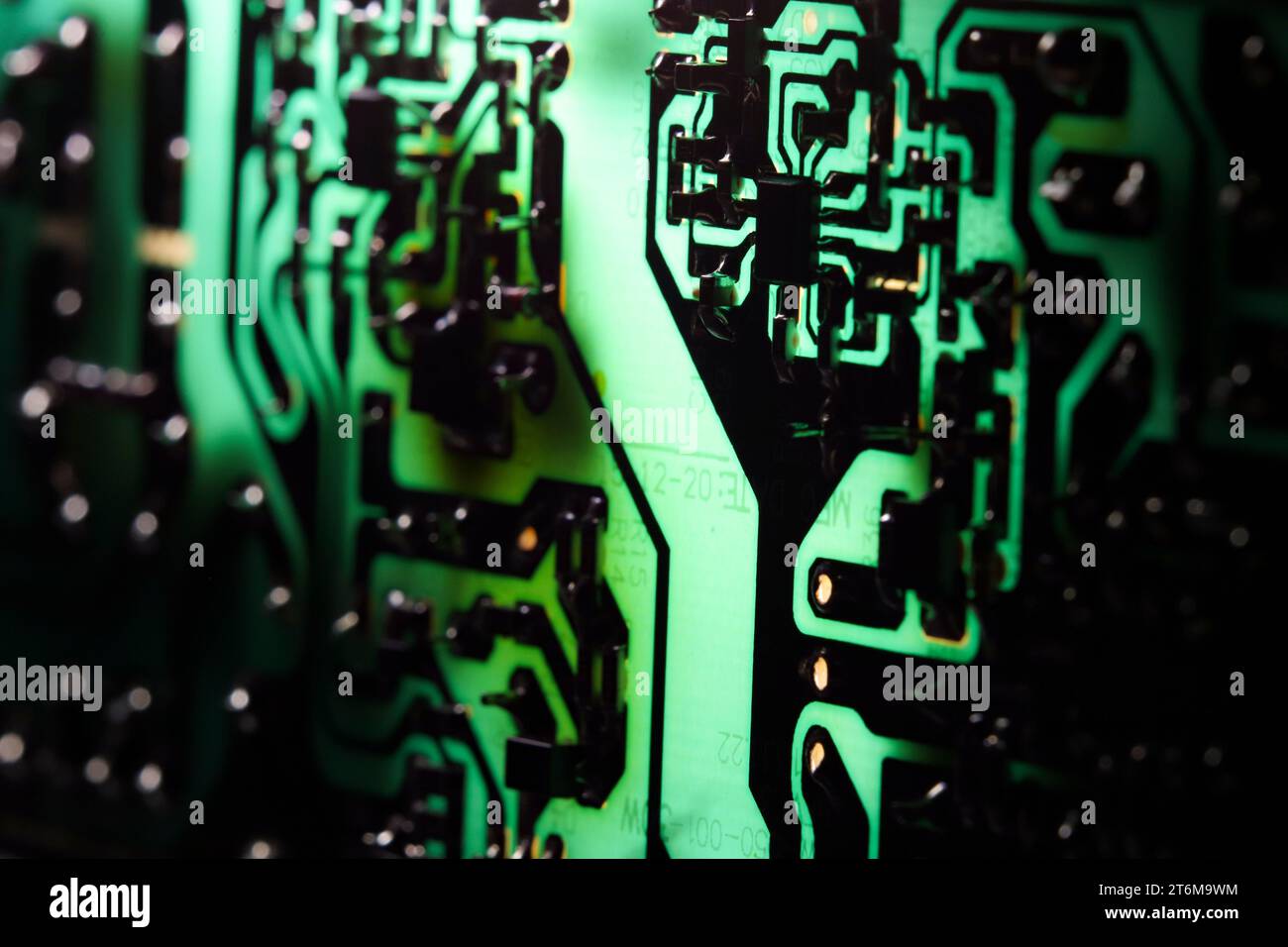 Glowing electronic circuit board close up. Technology macrophotograph ...