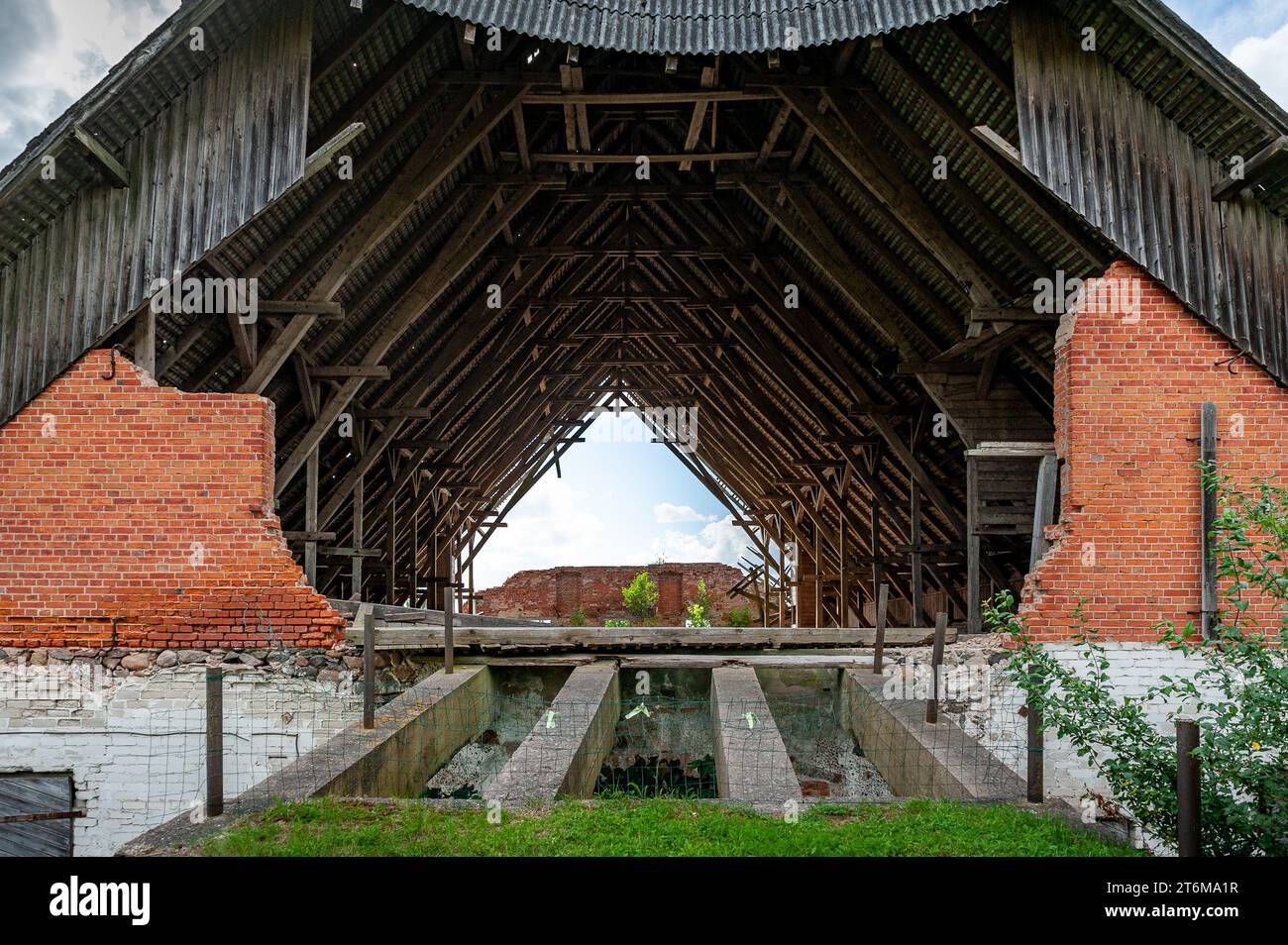 Abandoned Barn. Weathered and worn red barn on an abandoned farm ...