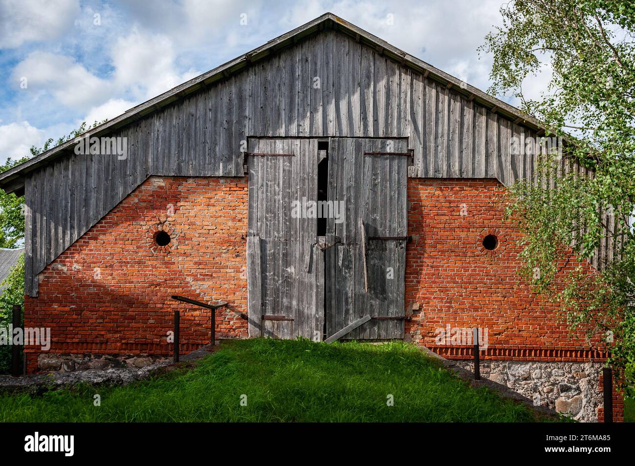 Abandoned Barn. Weathered and worn red barn on an abandoned farm ...