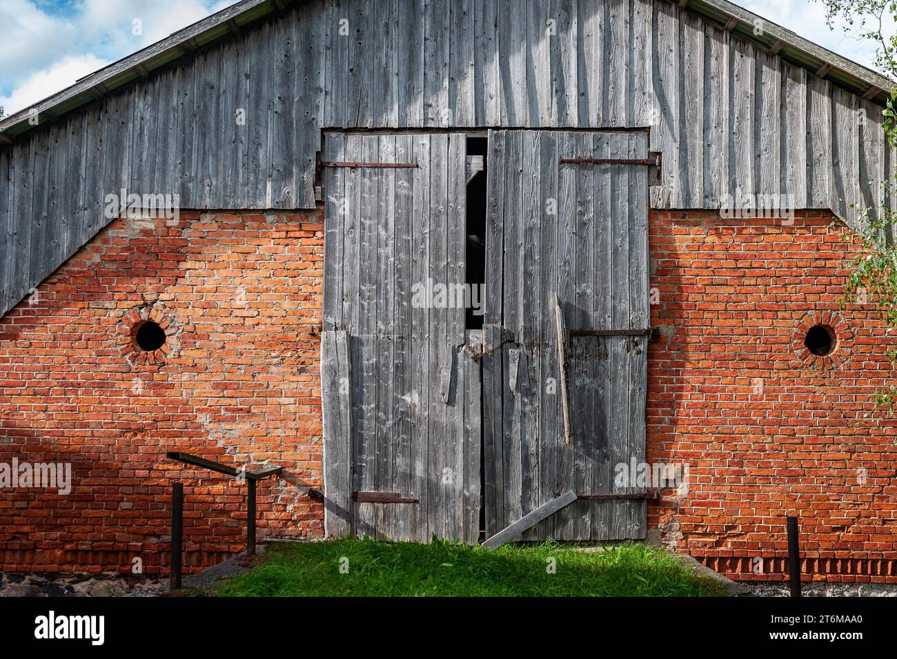 Abandoned Barn. Weathered and worn red barn on an abandoned farm ...