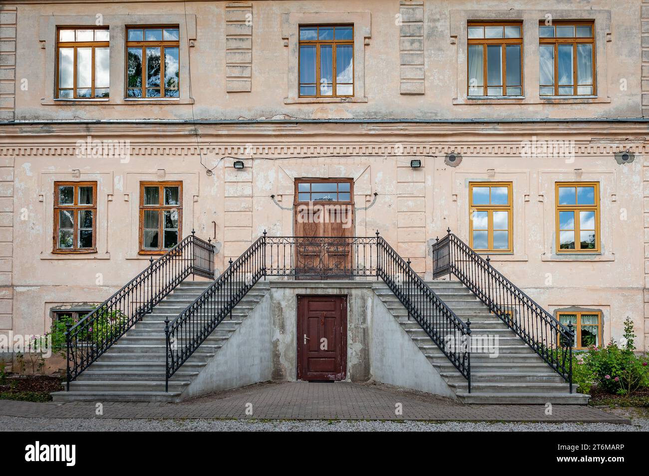 Staircase with metal wrought iron railings. Entrance group in mansion ...