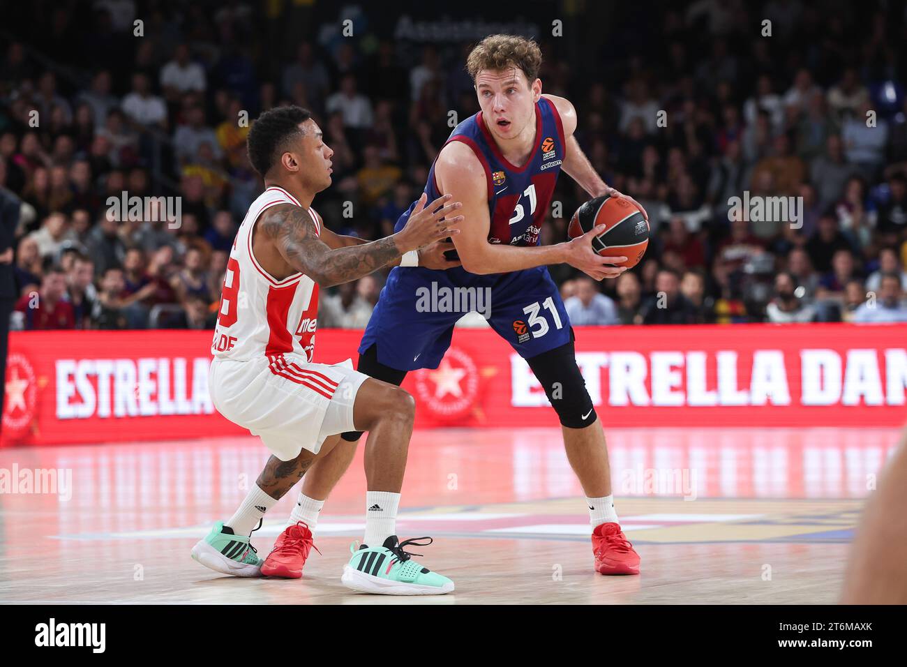 Rokas Jokubaitis of FC Barcelona in action with Yago Dos Santos of ...