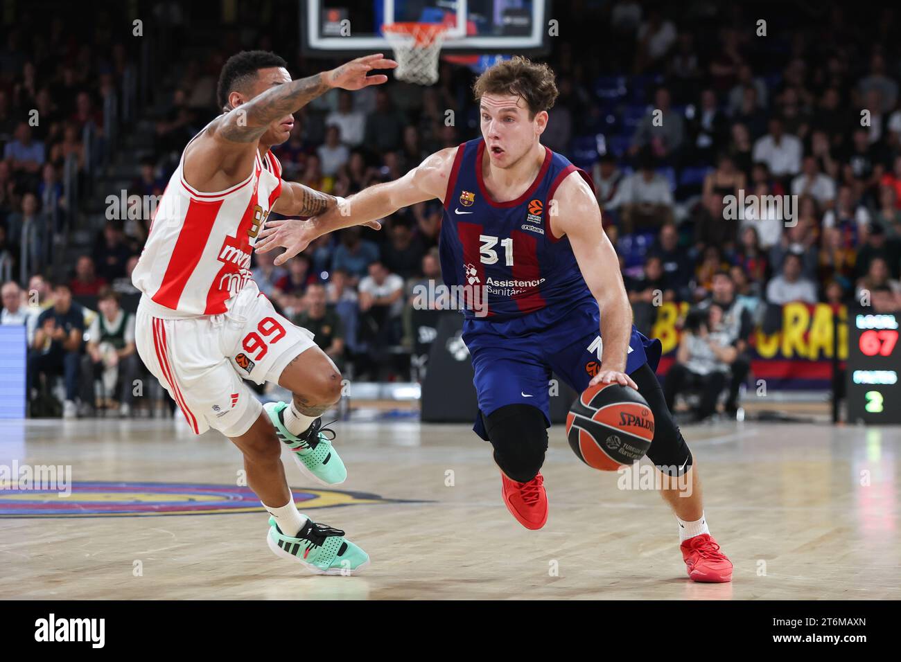 Rokas Jokubaitis of FC Barcelona in action with Yago Dos Santos of ...
