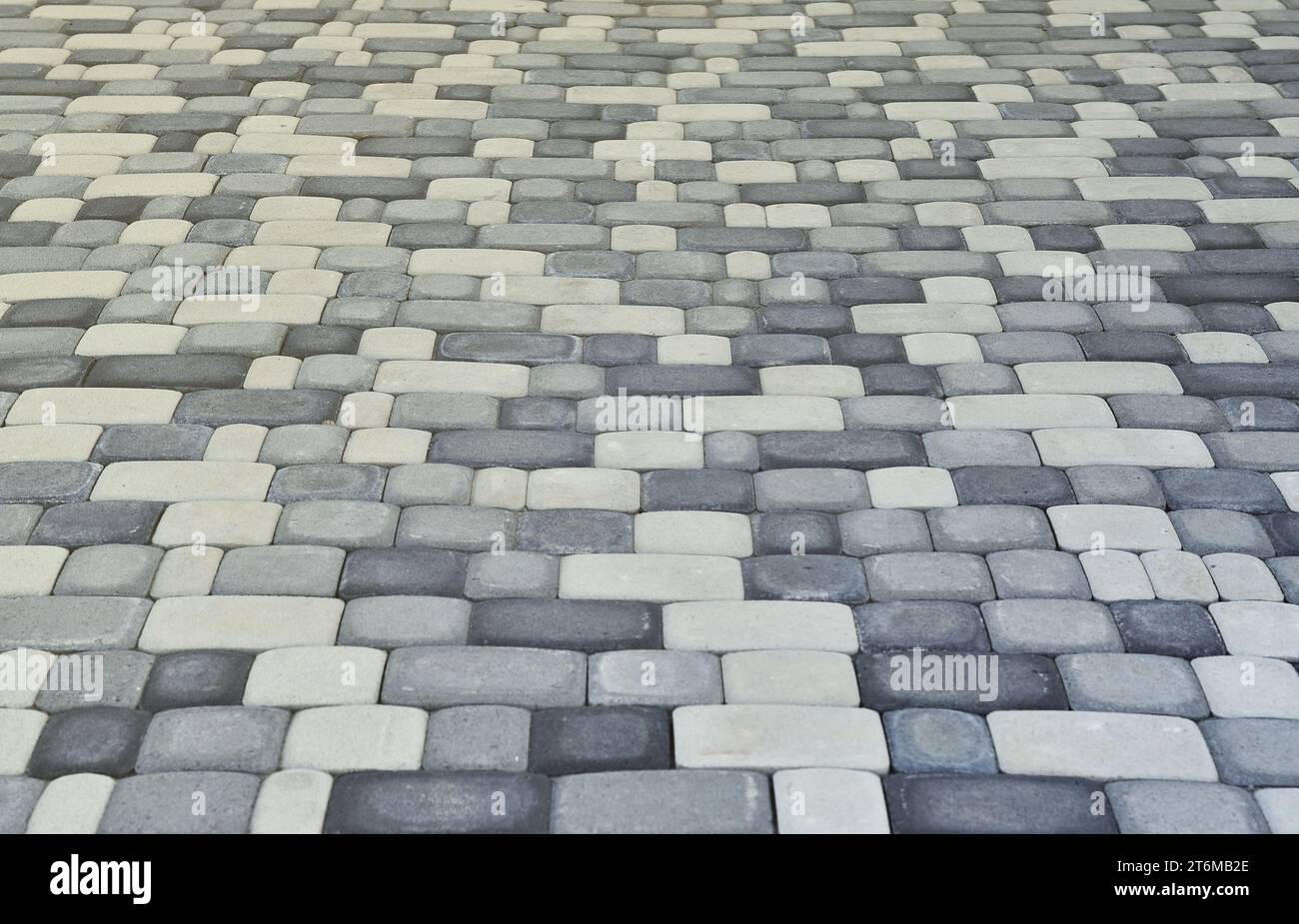 A detailed photo of the square, laid out of modern paving stone with ...