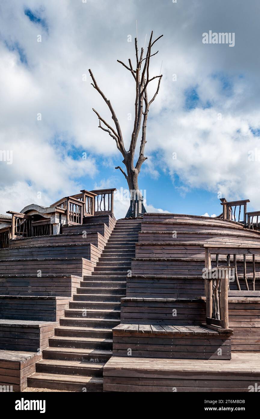 Wooden recreation zone in shape of circles. Round benches in middle of ...