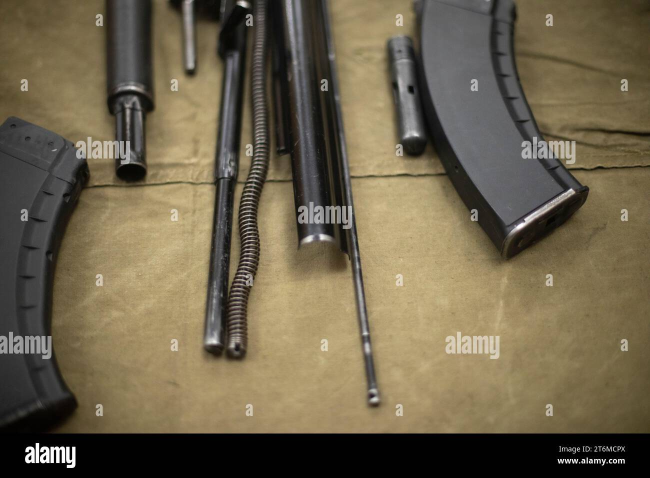 Weapon parts. Firearm. Disassembled automatic weapon barrel. Military ...