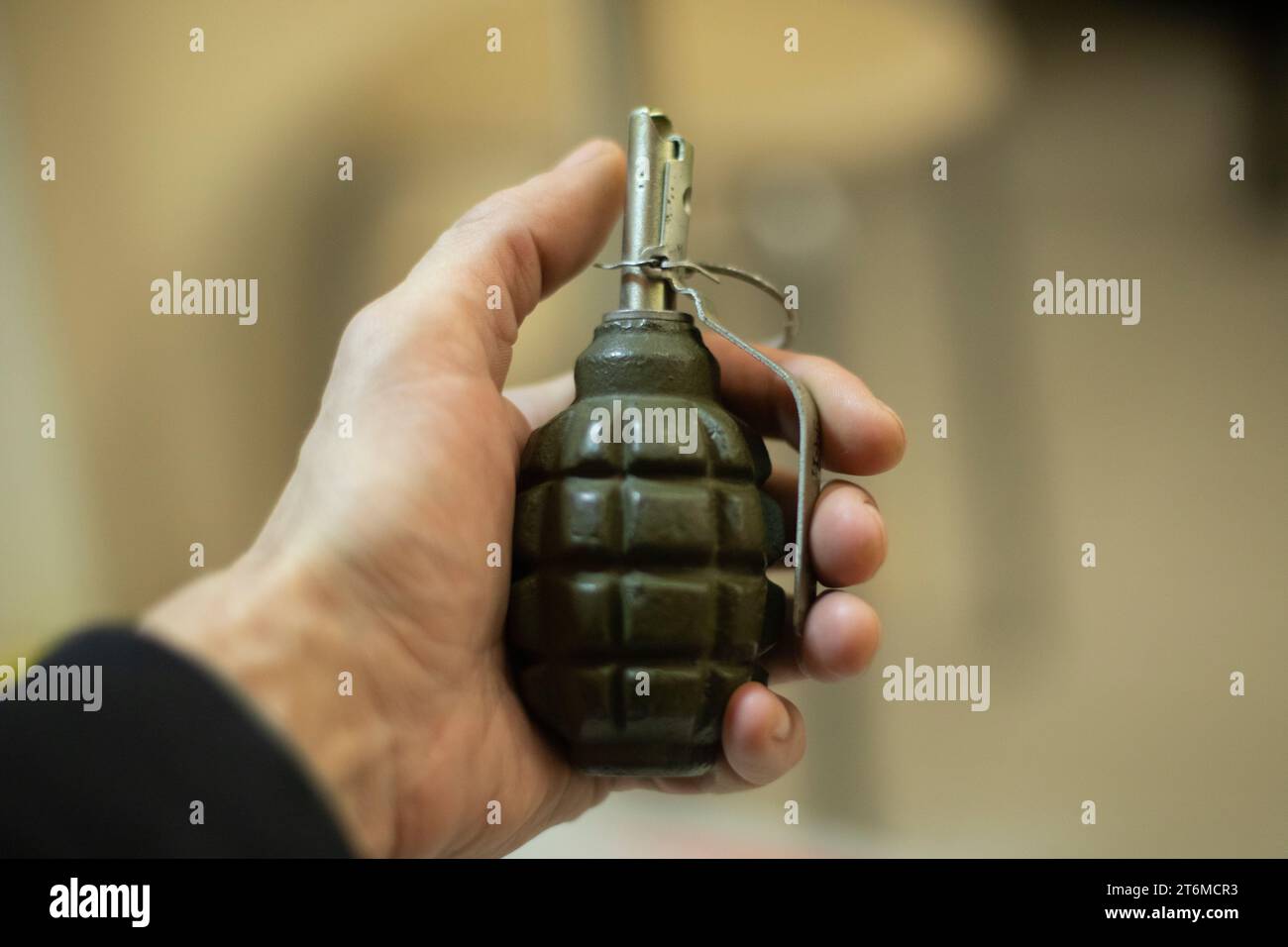 Grenade in hand. Training grenade. Explosives detonator. Military ...