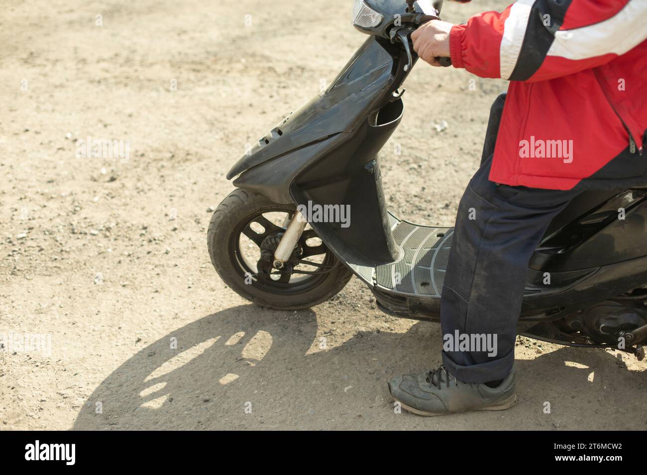 Moped on street. Man on scooter. Easy transport. Man rides motorcycle ...