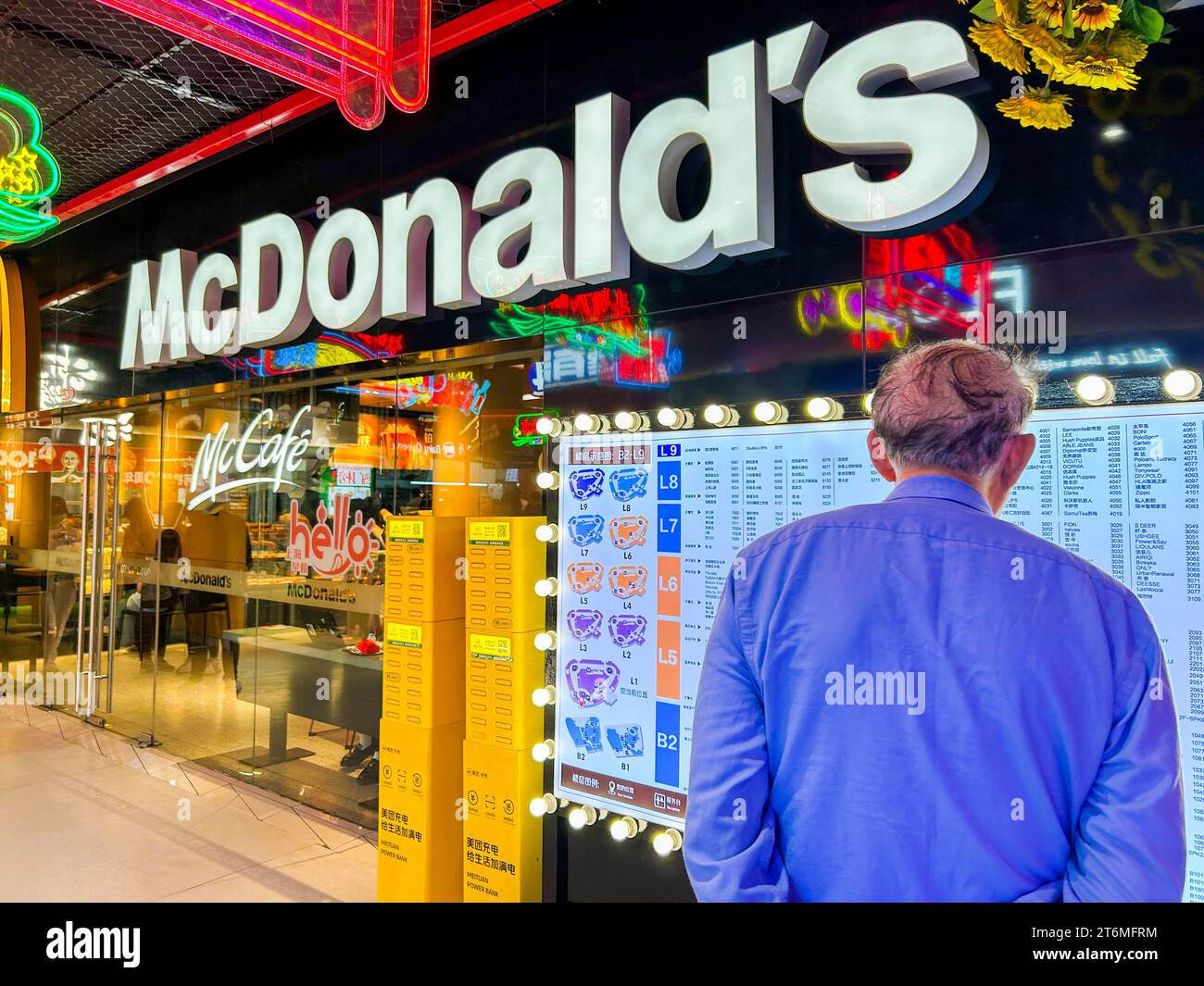Shanghai, China, Business neighborhood, Man From Behind, Reading Sign ...