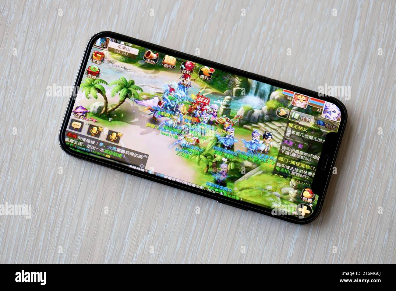 Fantasy Westward Journey mobile iOS game on iPhone 15 smartphone screen ...