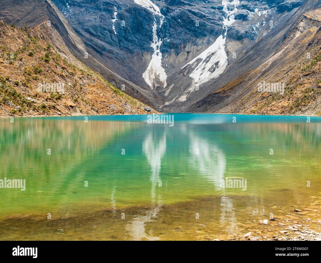 Amazing view of the emerald waters of Humantay lagoon with the glacier ...