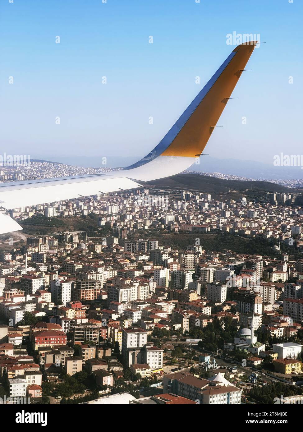 Aerial view of Istanbul with buildings from the plane with long wing ...