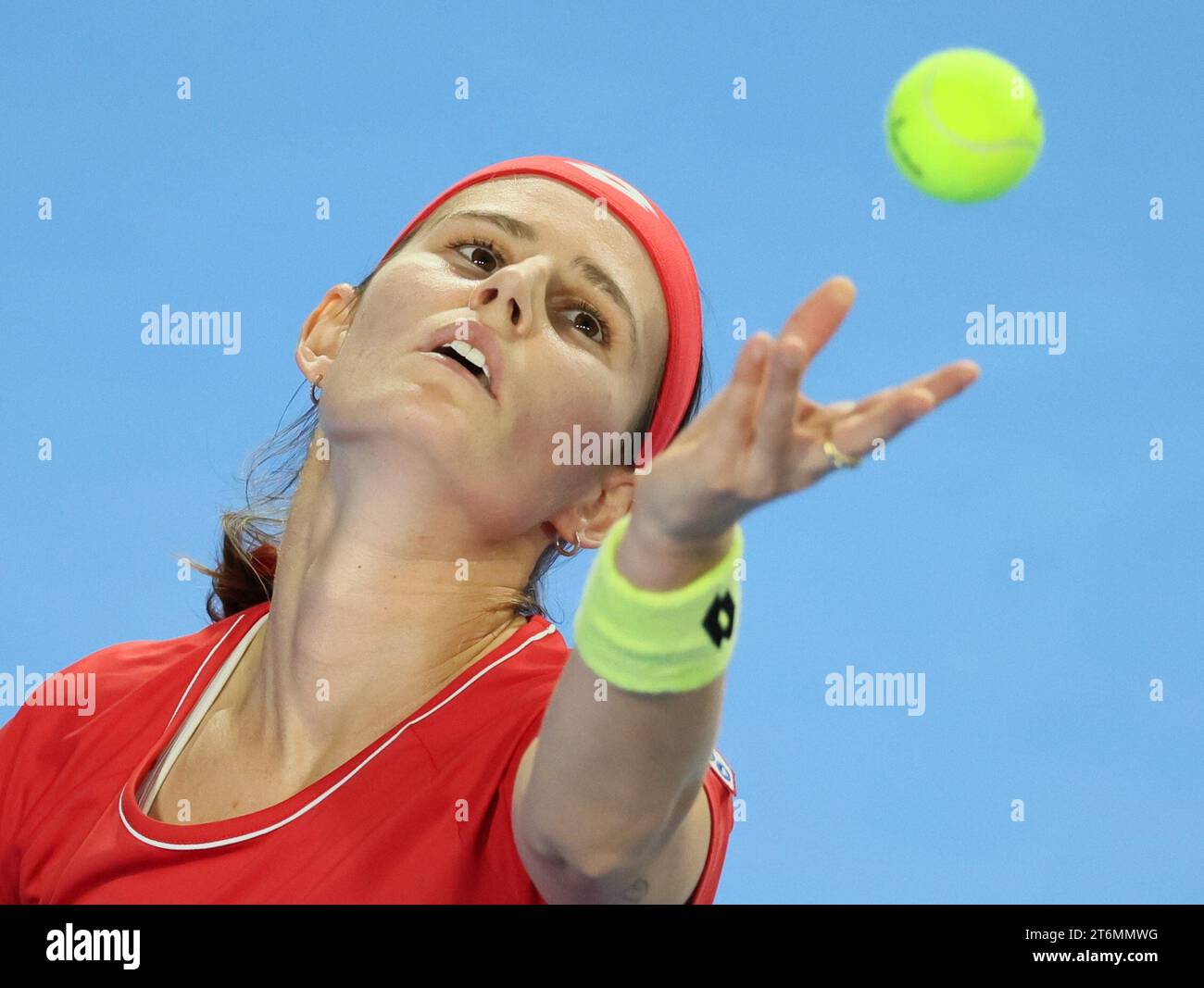 Belgian Greet Minnen tosses the ball to serve during a tennis match ...