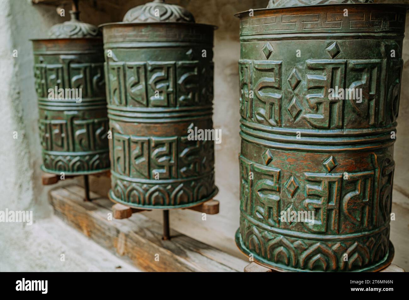 Buddhist prayer bronze drum close-up. Om padme hum. Asian symbol ...