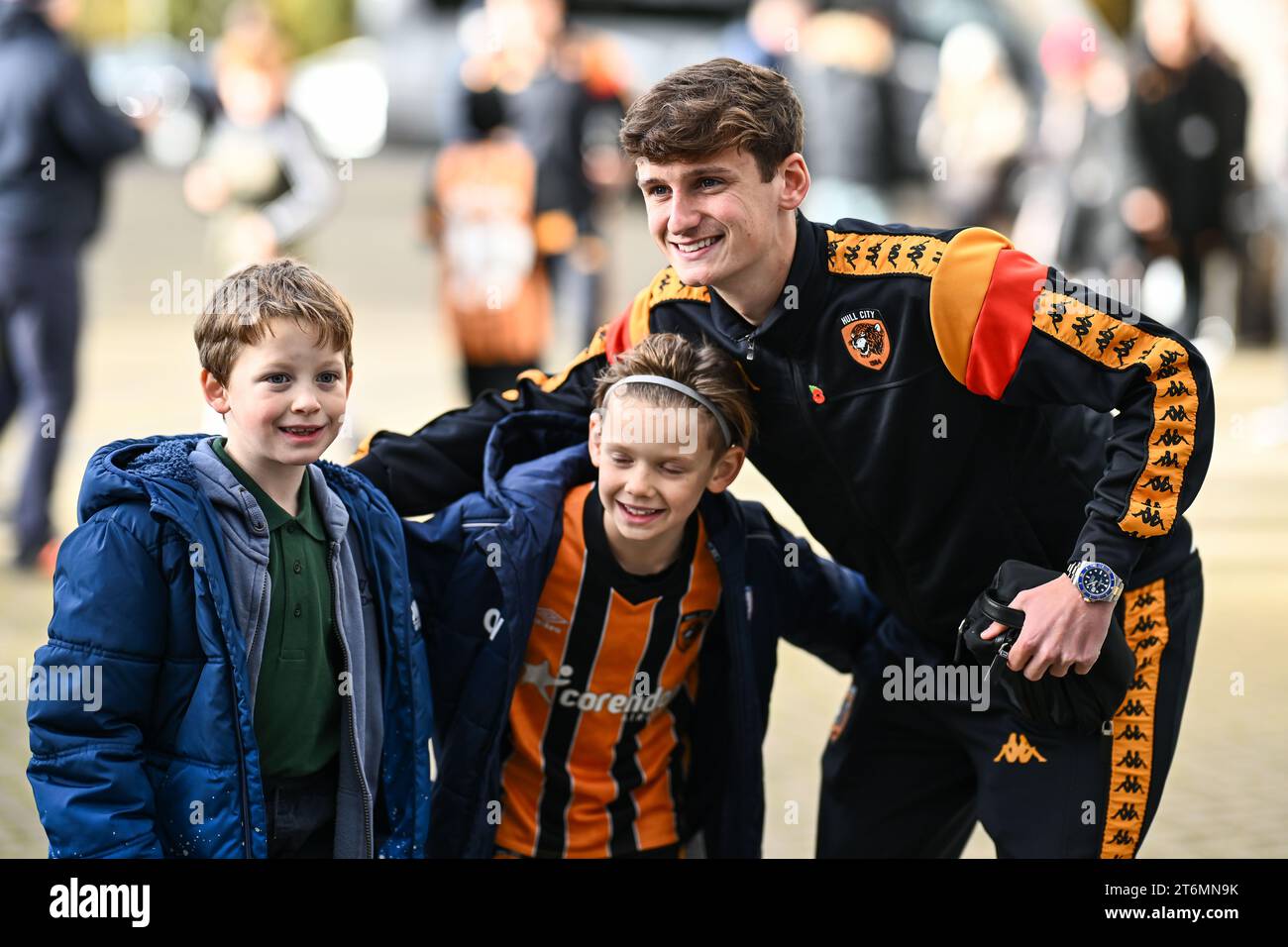 Tyler Morton #15 of Hull City takes a photo with young fans as he ...