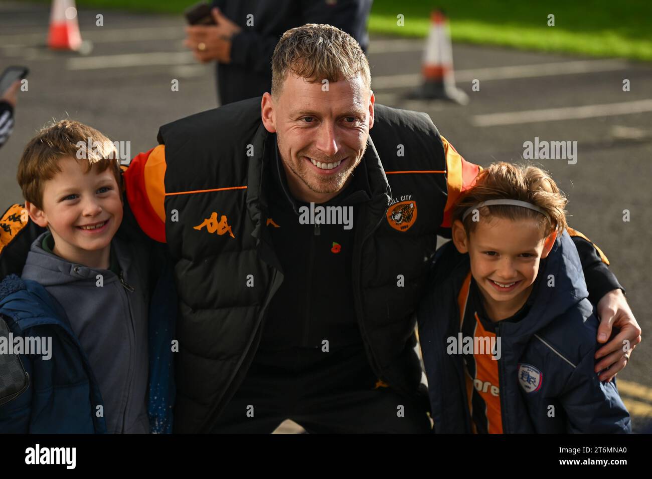 Ryan Allsop #17 of Hull City takes a photo with young fans as he ...