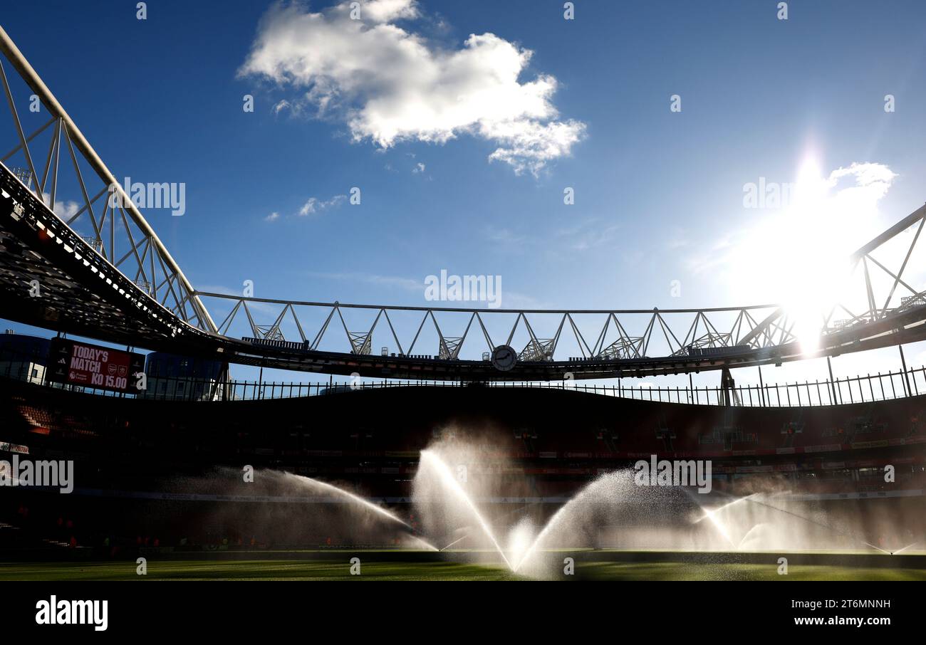 General view from inside the stadium as sprinkles water the pitch ...