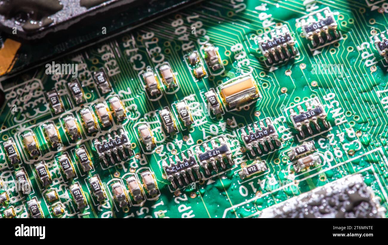 wet digital circuit board with microprocessors and components, closeup ...