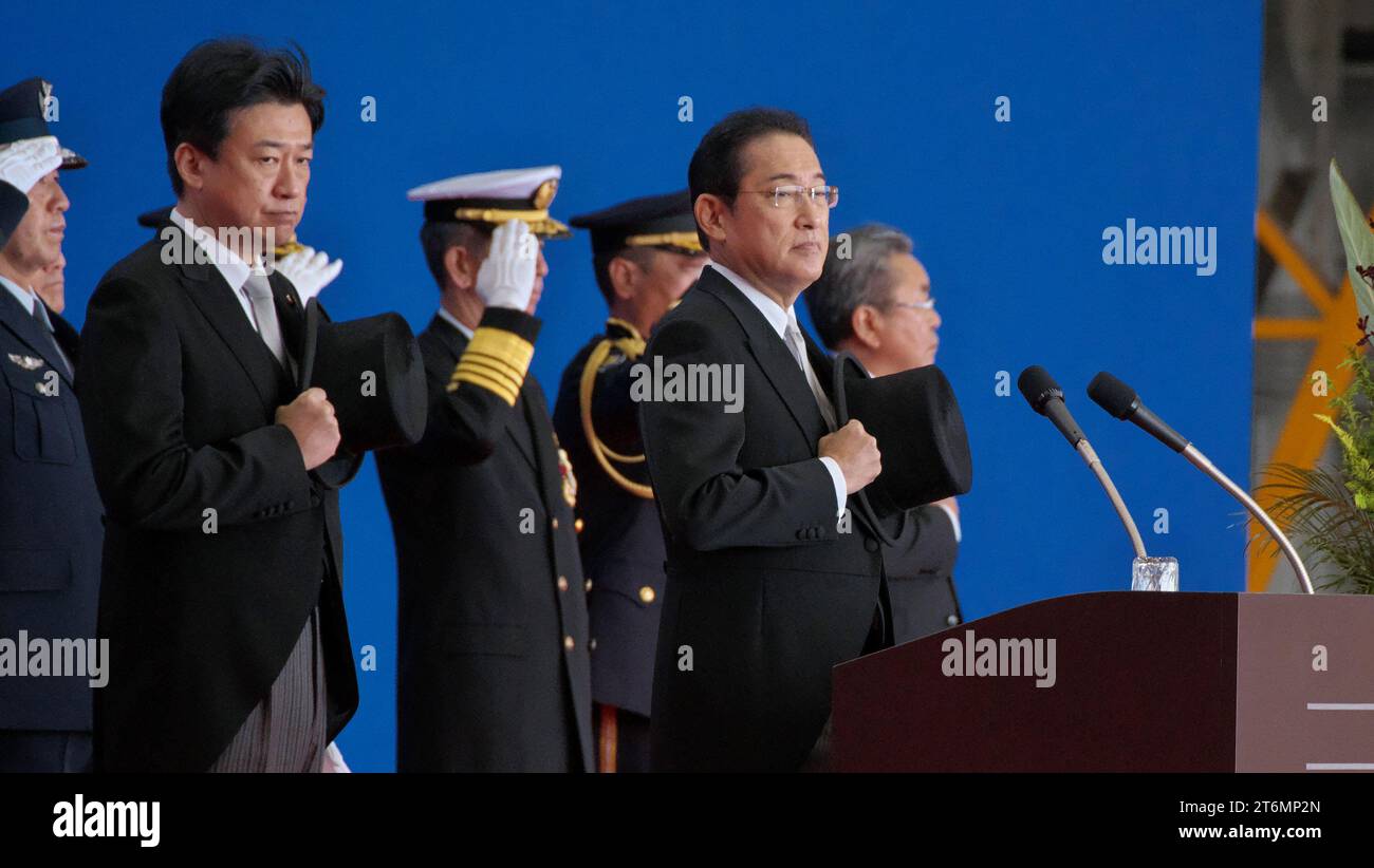 Japan's Defense Minister Yasukazu Hamada receives the salute of a guard ...