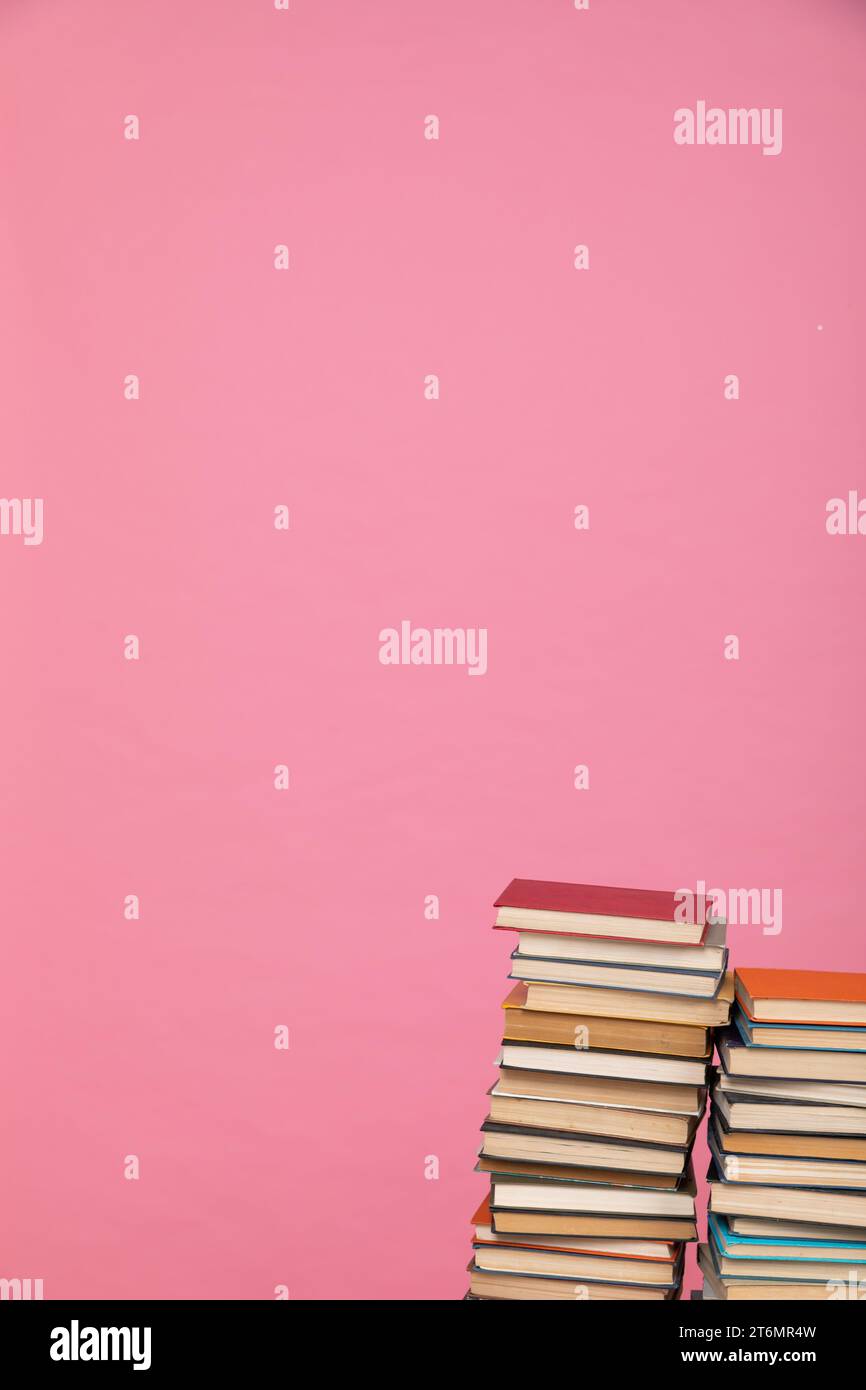 science education stack of books on pink background literacy training ...