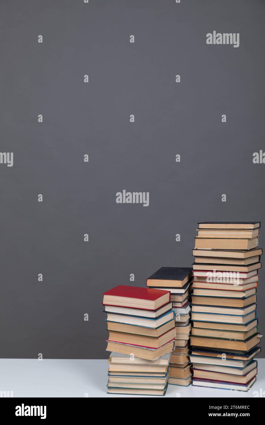 science education stack of books on grey background learning literacy ...