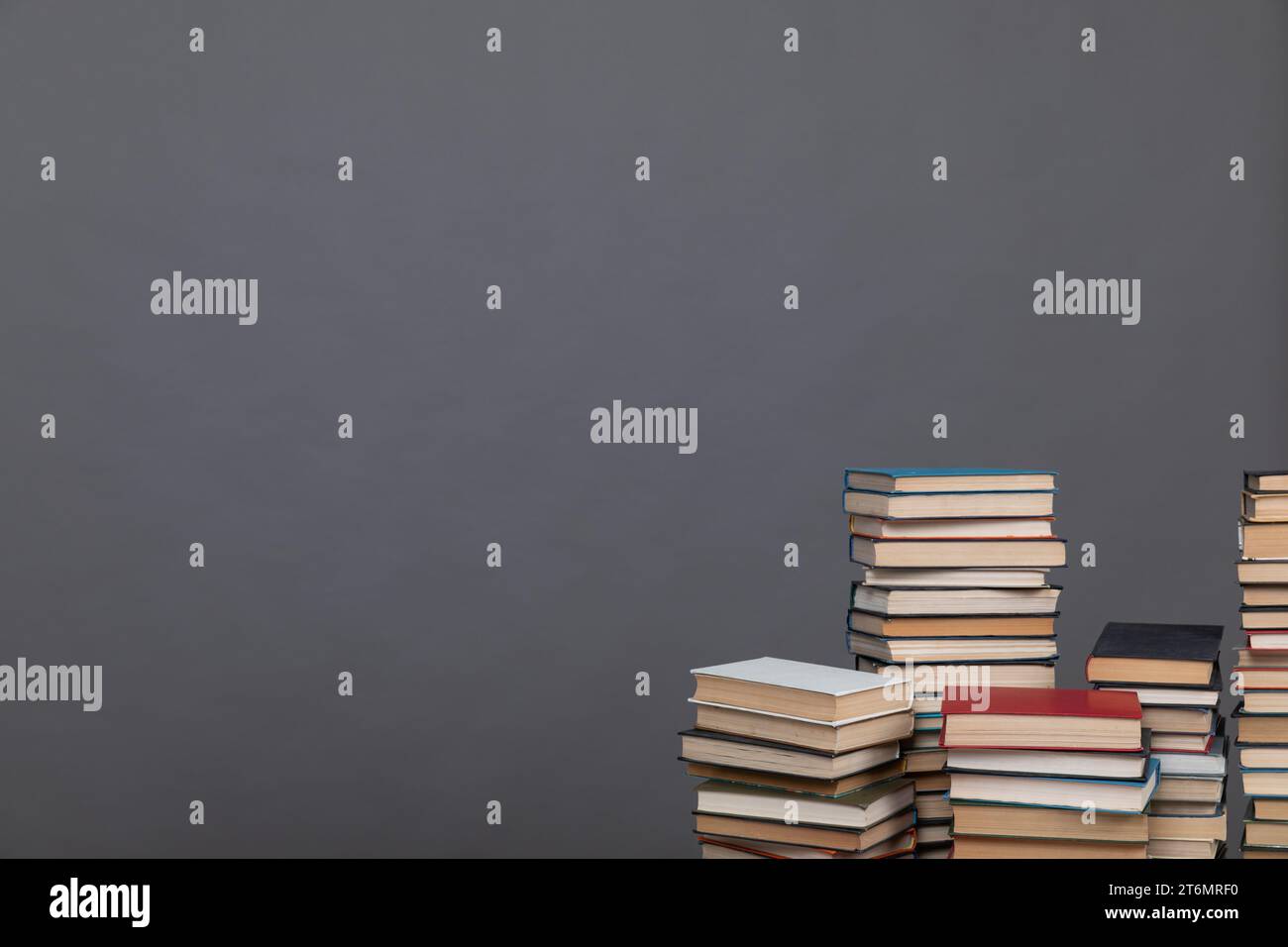 science education stack of books on grey background learning literacy ...
