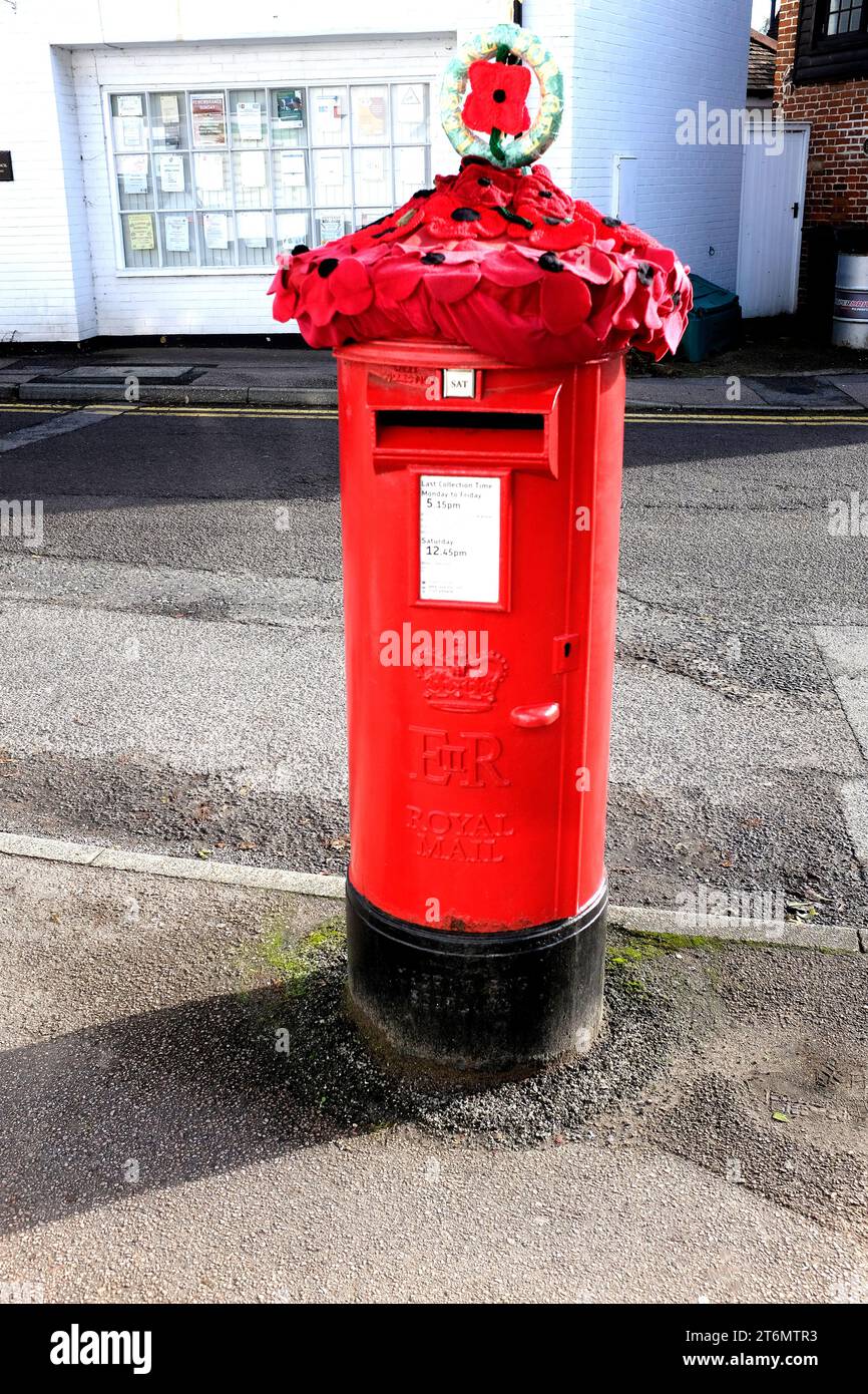 red post box with commemorative red felt poppys adorning Stock Photo ...