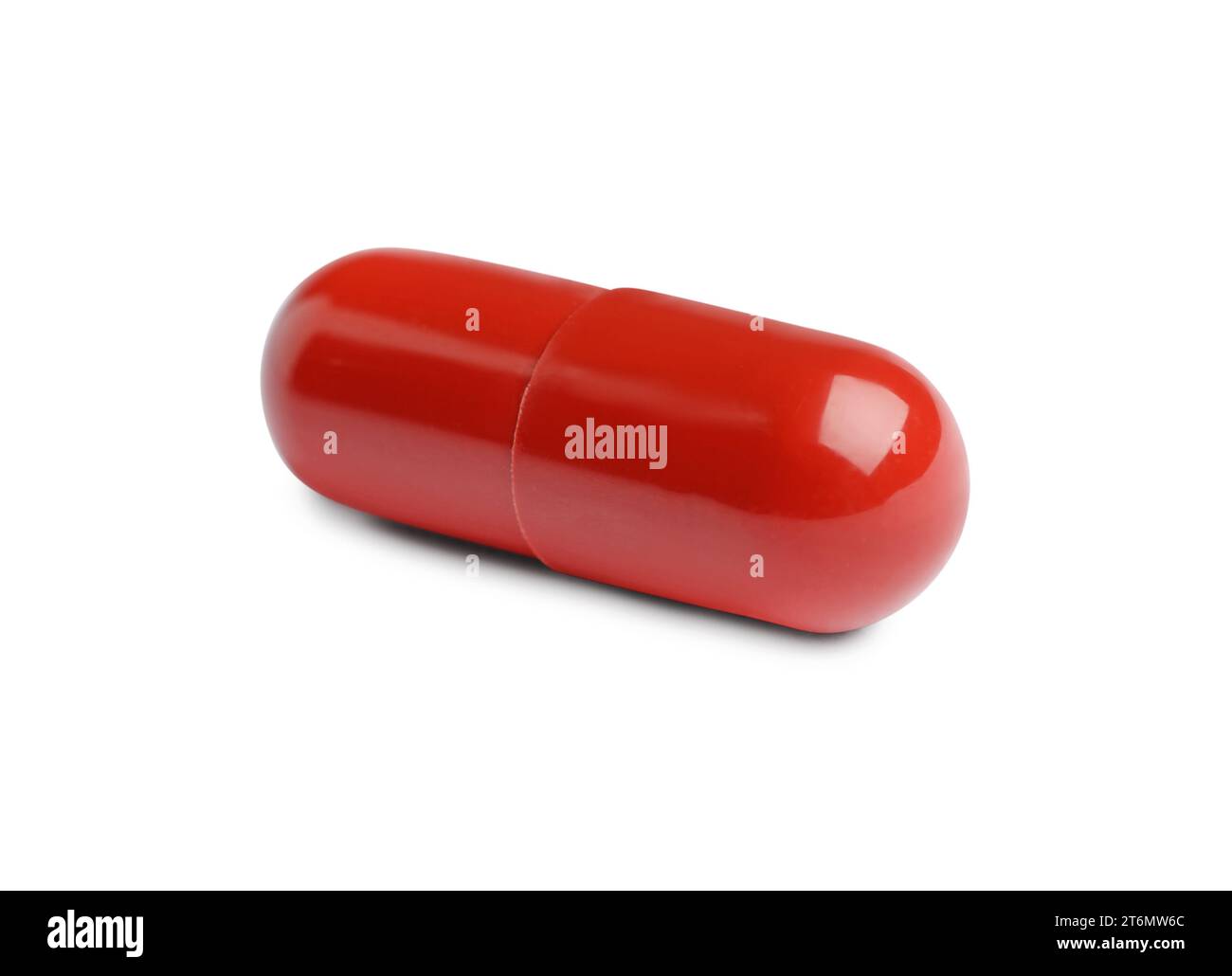 One red pill on white background. Medicinal treatment Stock Photo - Alamy