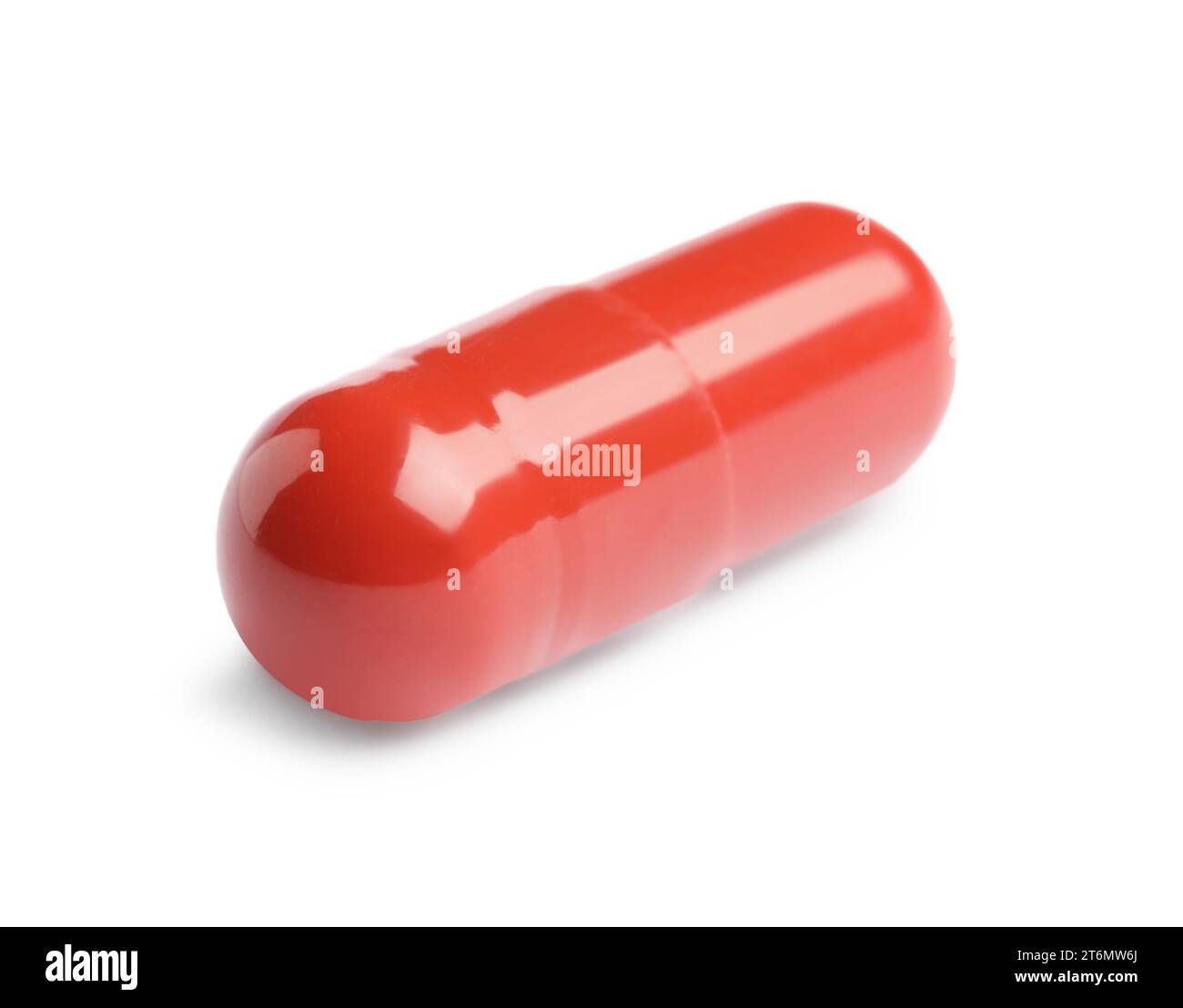 One red pill on white background. Medicinal treatment Stock Photo - Alamy