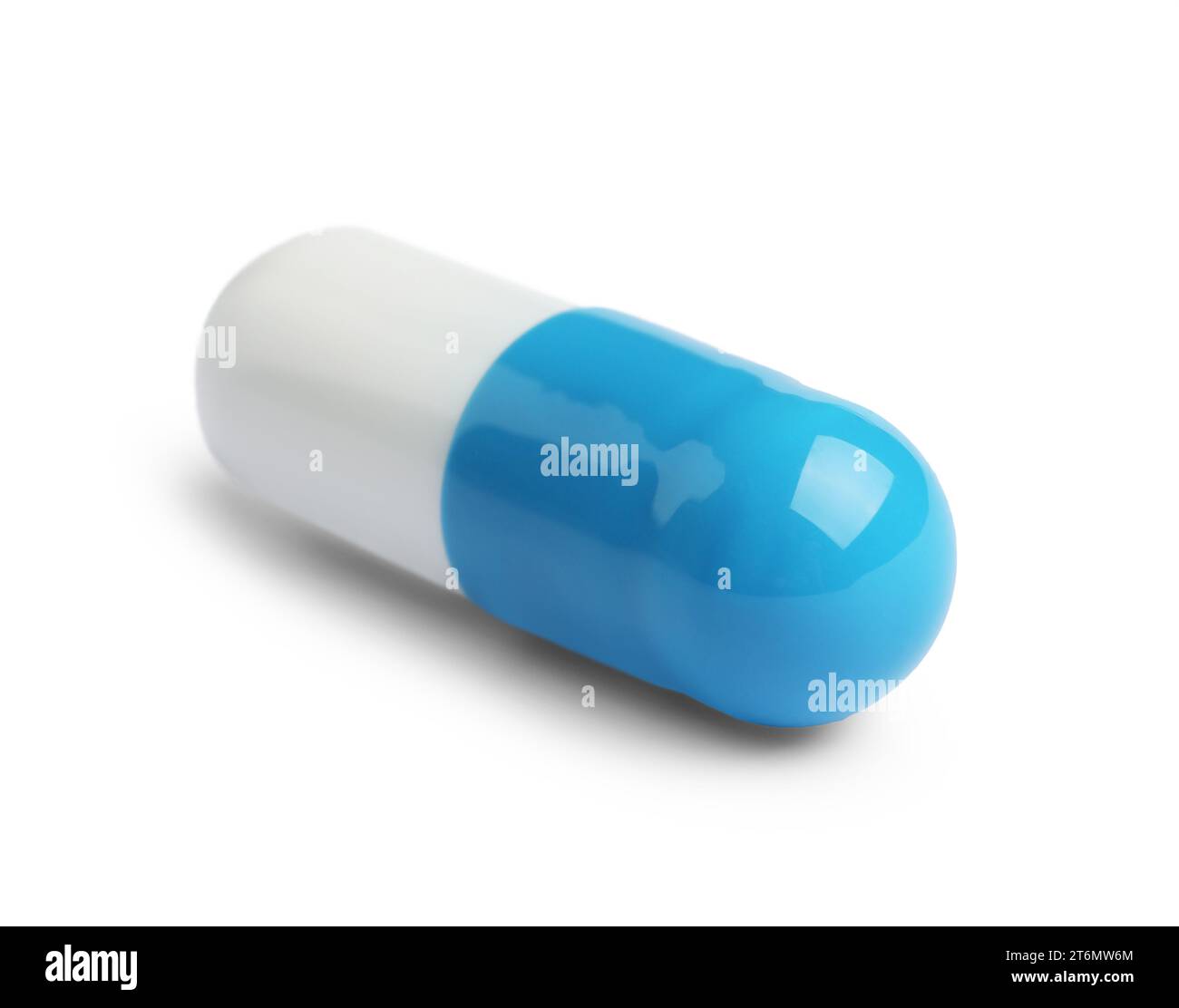 One pill on white background. Medicinal treatment Stock Photo - Alamy