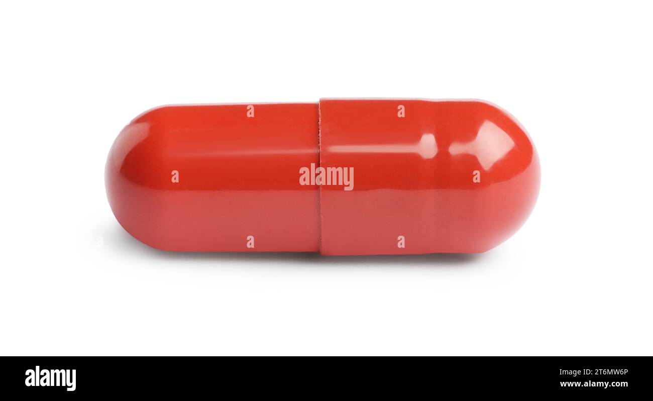 One red pill on white background. Medicinal treatment Stock Photo - Alamy