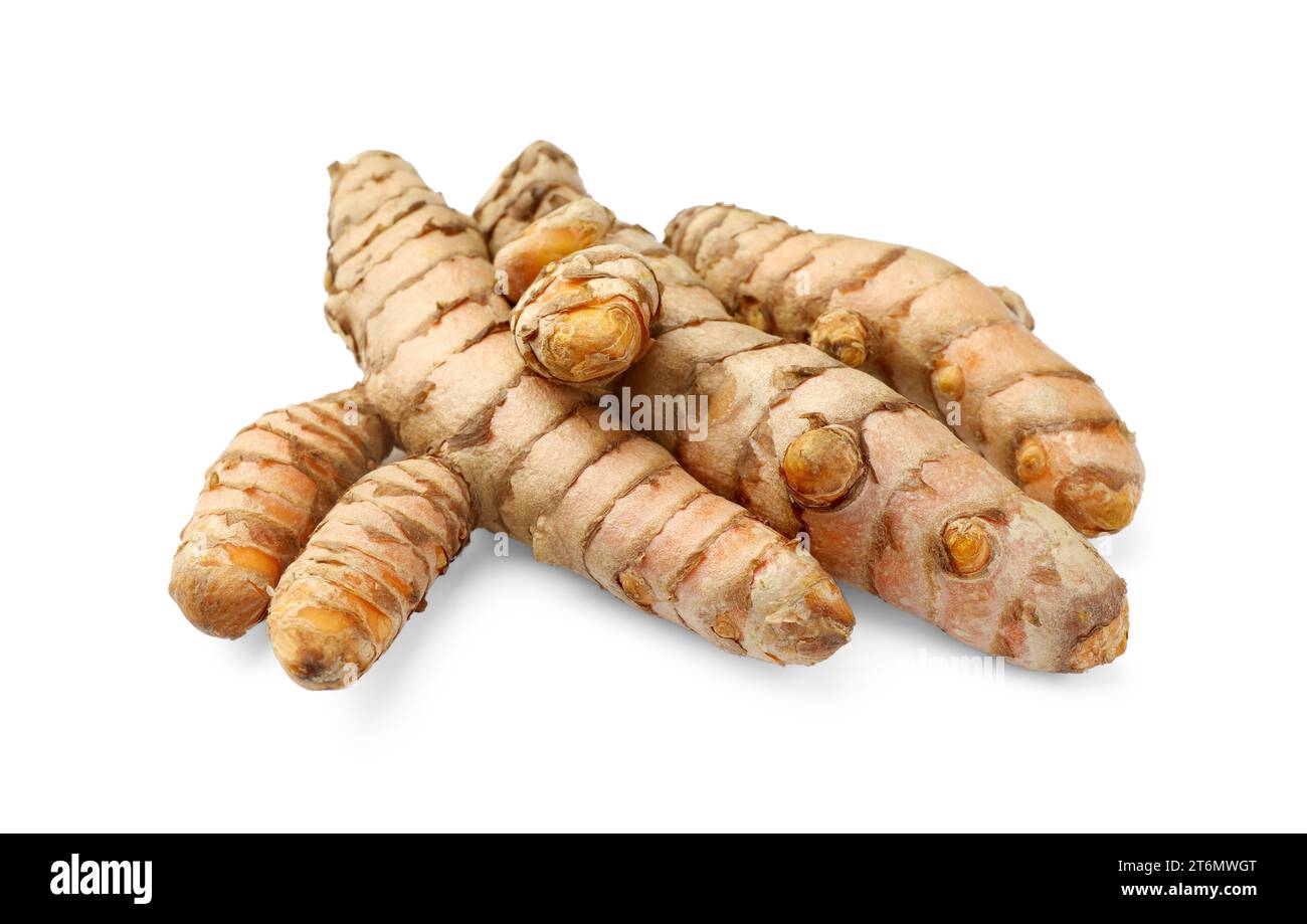 Fresh whole turmeric roots isolated on white Stock Photo - Alamy