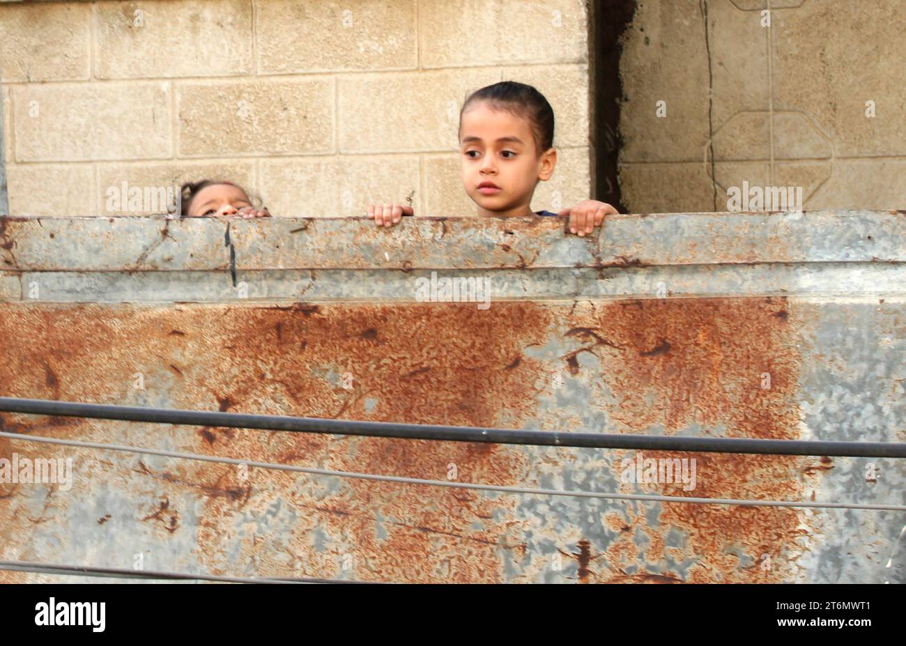 Children look at the destruction following Israeli bombing on Rafah in ...