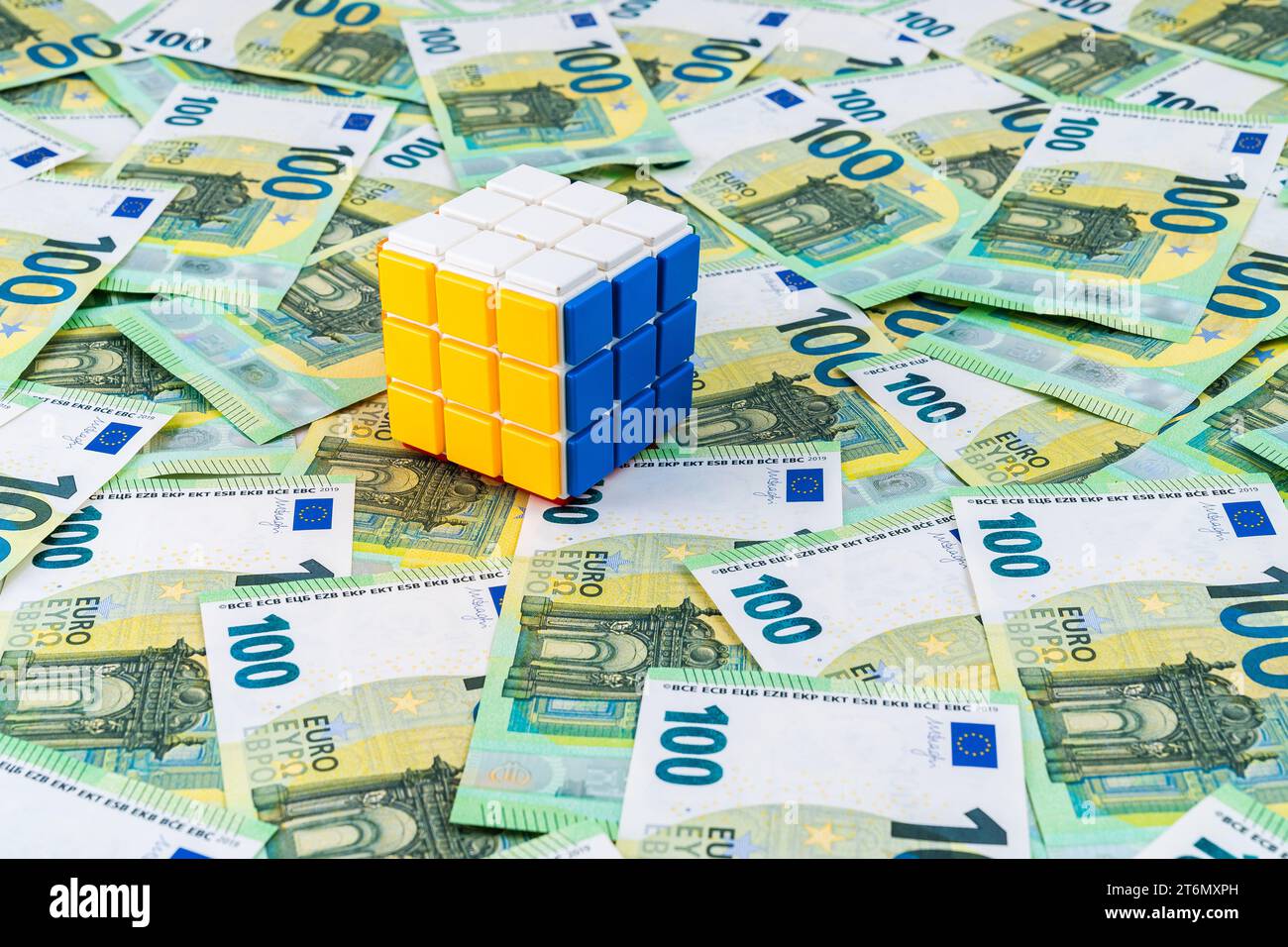 Solved rubik cube in Ukrainian flag colors over many euro banknotes ... Solved rubik cube in Ukrainian flag colors over many euro banknotes ...