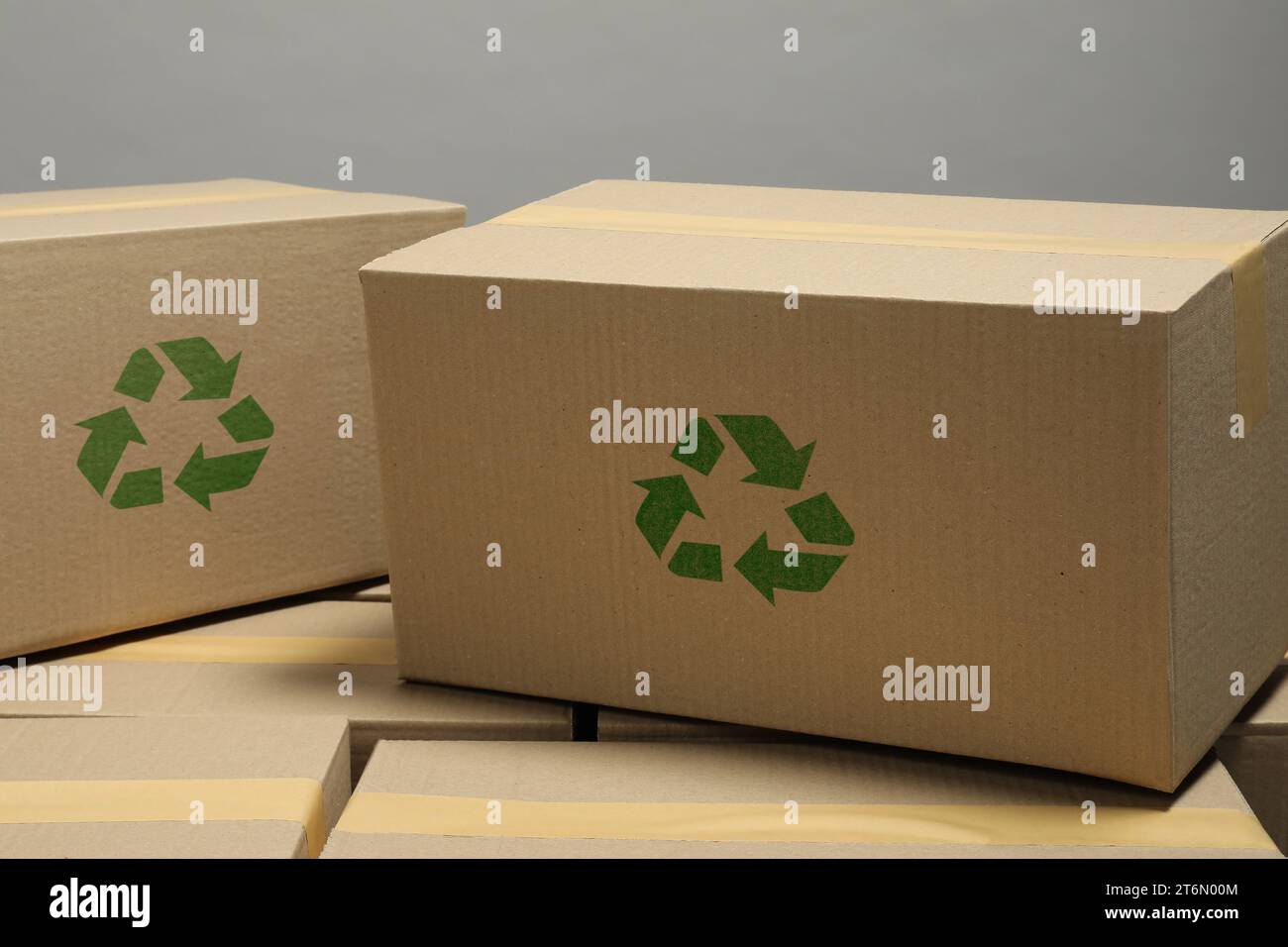 Cardboard boxes with recycle sign stamps on grey background Stock Photo ...