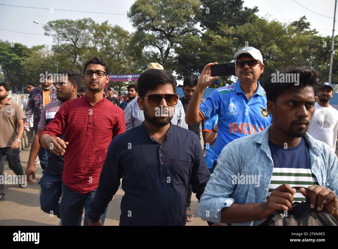 Cheerful spectators entering into the Eden Gardens stadium in Kolkata ...