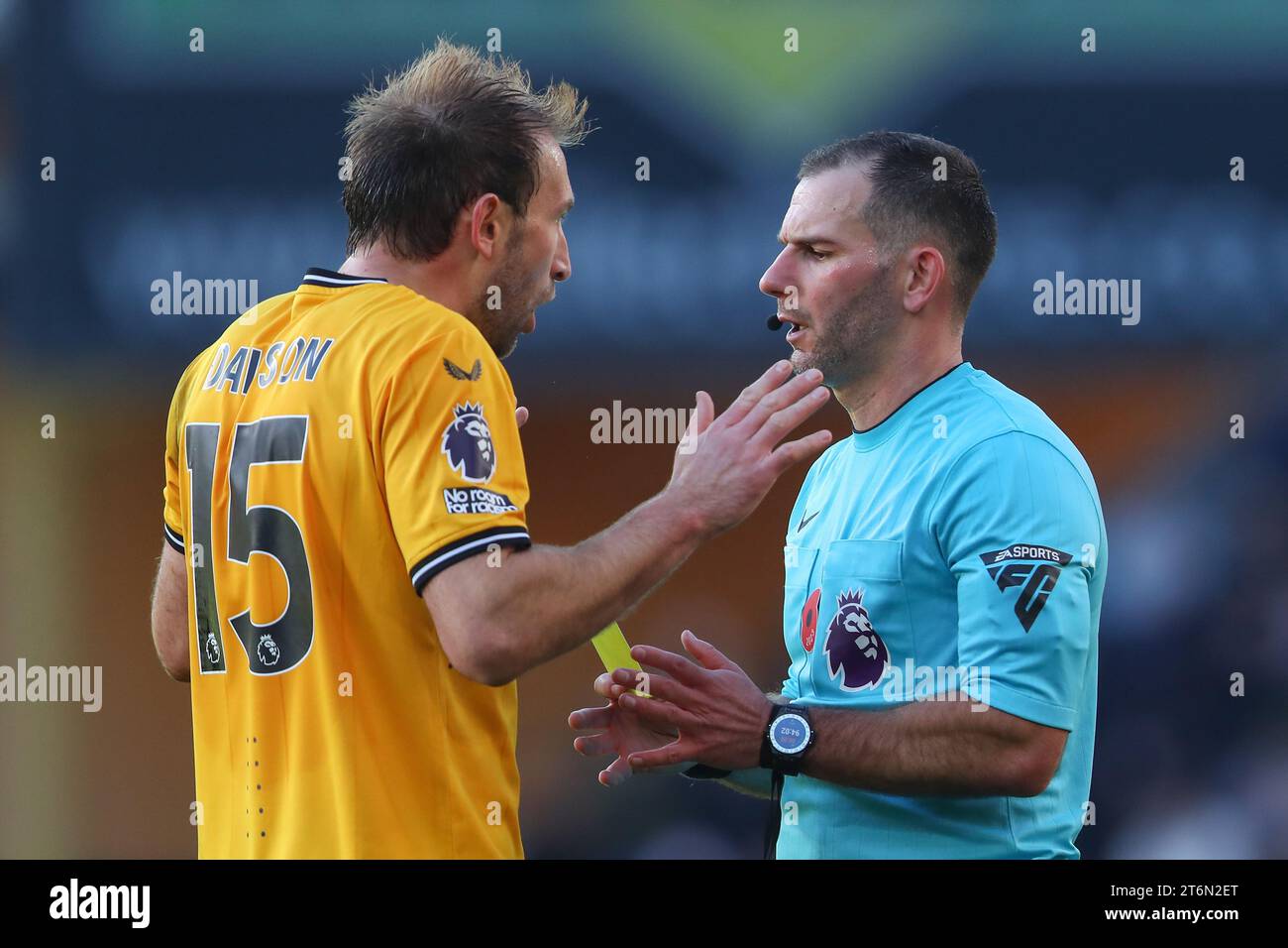 Craig Dawson #15 of Wolverhampton Wanderers talks to referee Tim ...
